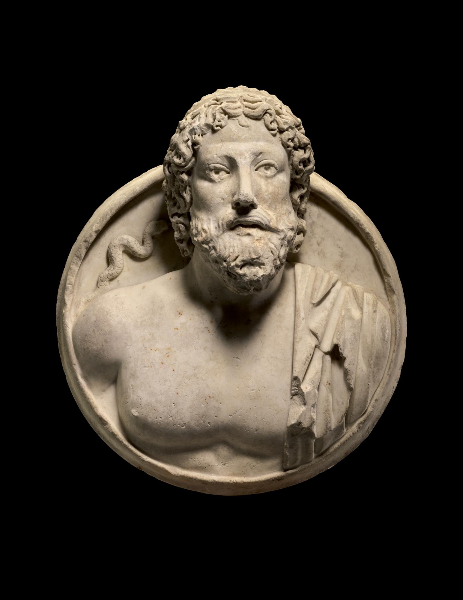A LATE ROMAN MARBLE CLIPEUS BUST OF ASKLEPIOS, LATE 4TH CENTURY A.D ...