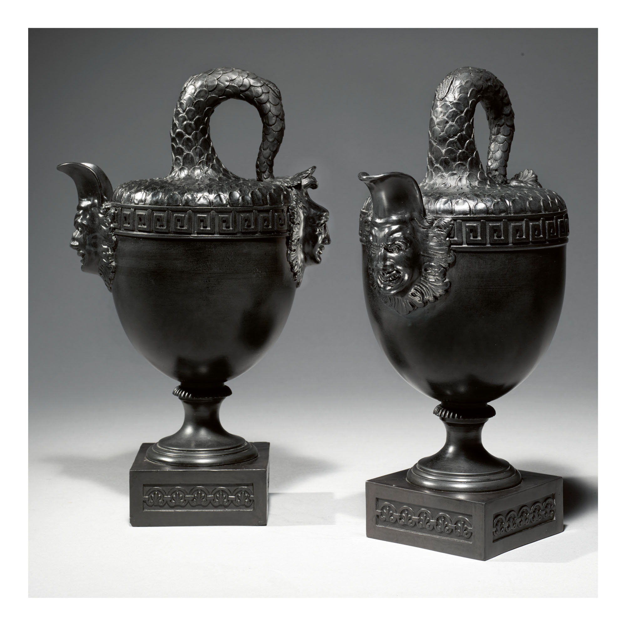 A PAIR OF WEDGWOOD STYLE BLACK BASALT 'FISH TAIL' EWER VASES 20TH ...