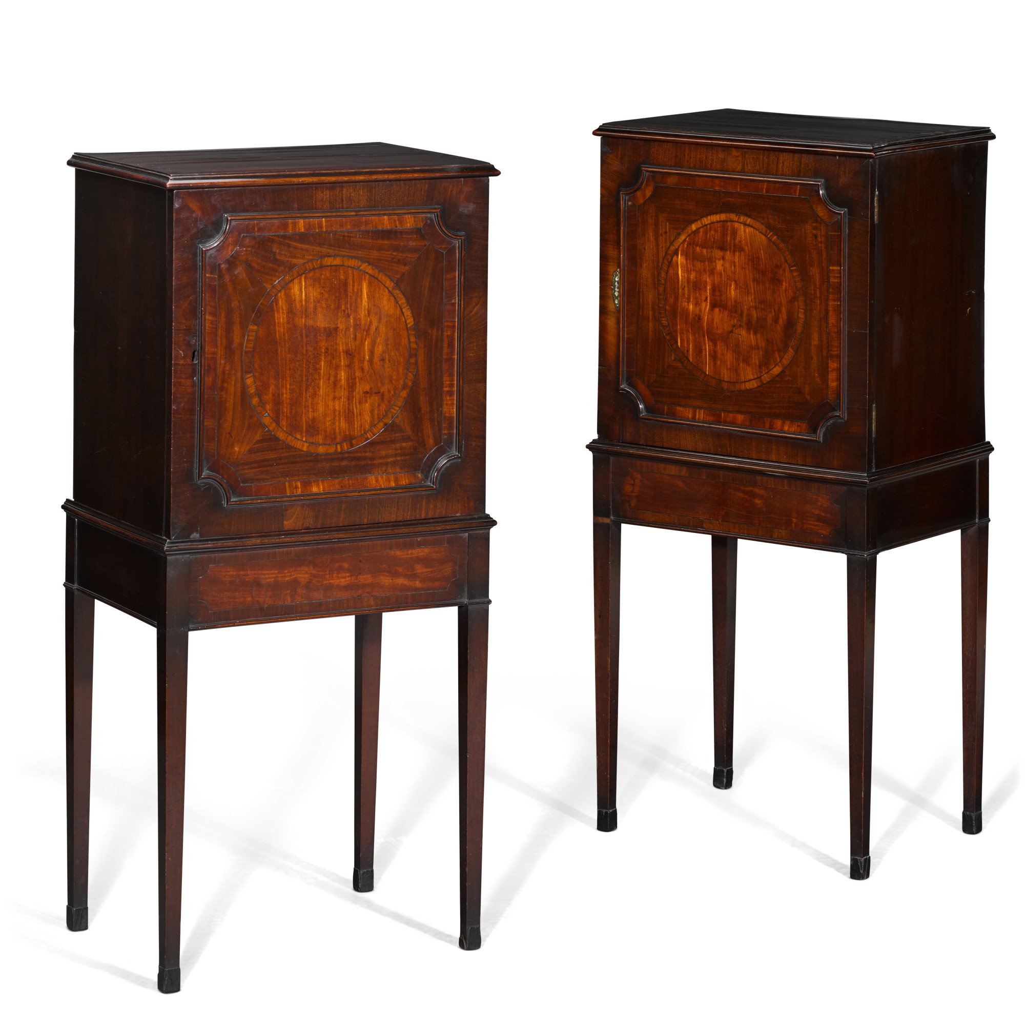 A pair of George III mahogany cabinets-on-stands, circa 1780-90 ...