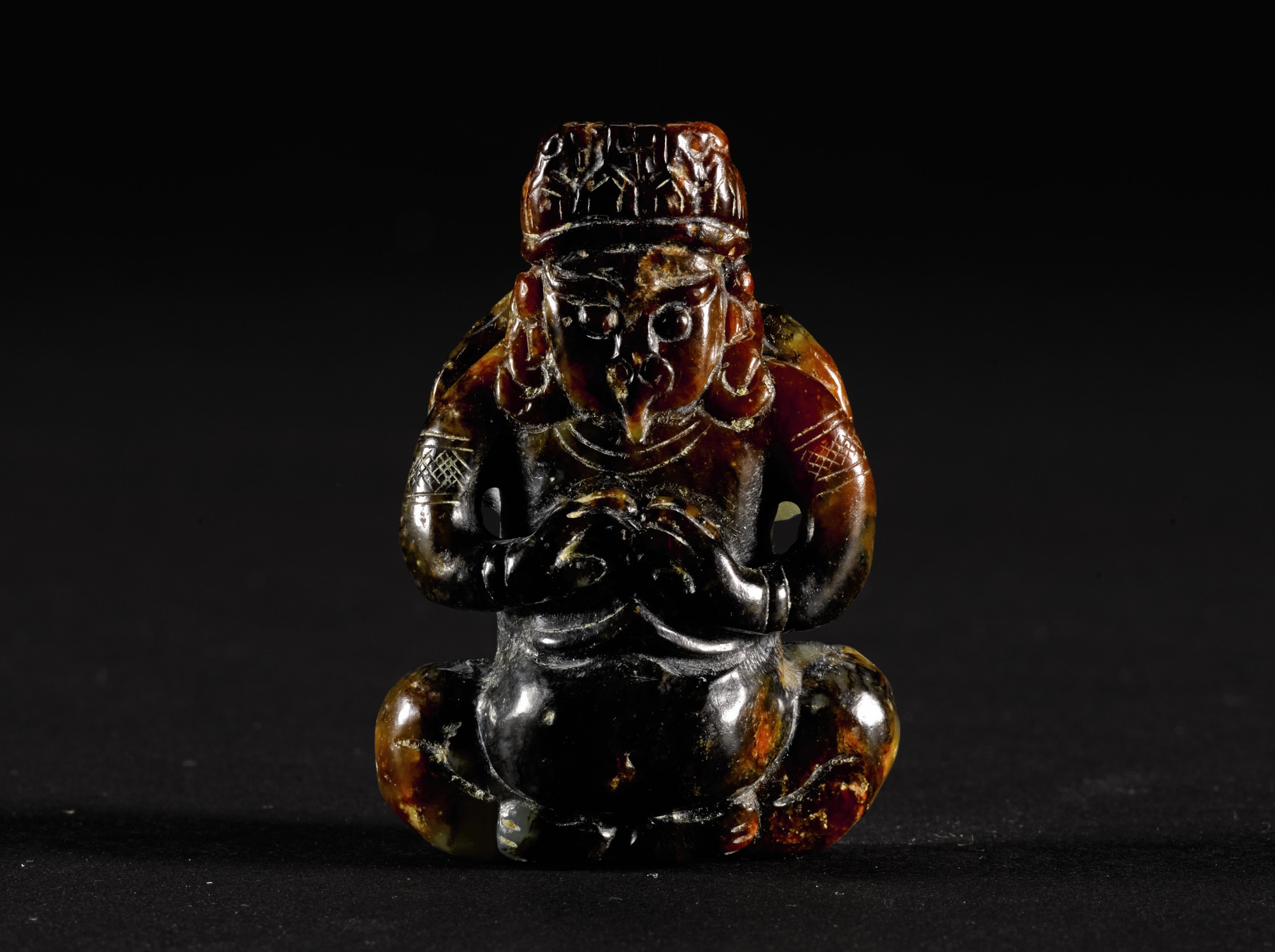 A BROWN JADE SEATED WINGED FIGURE YUAN DYNASTY | 元 玉神獸 | Important ...