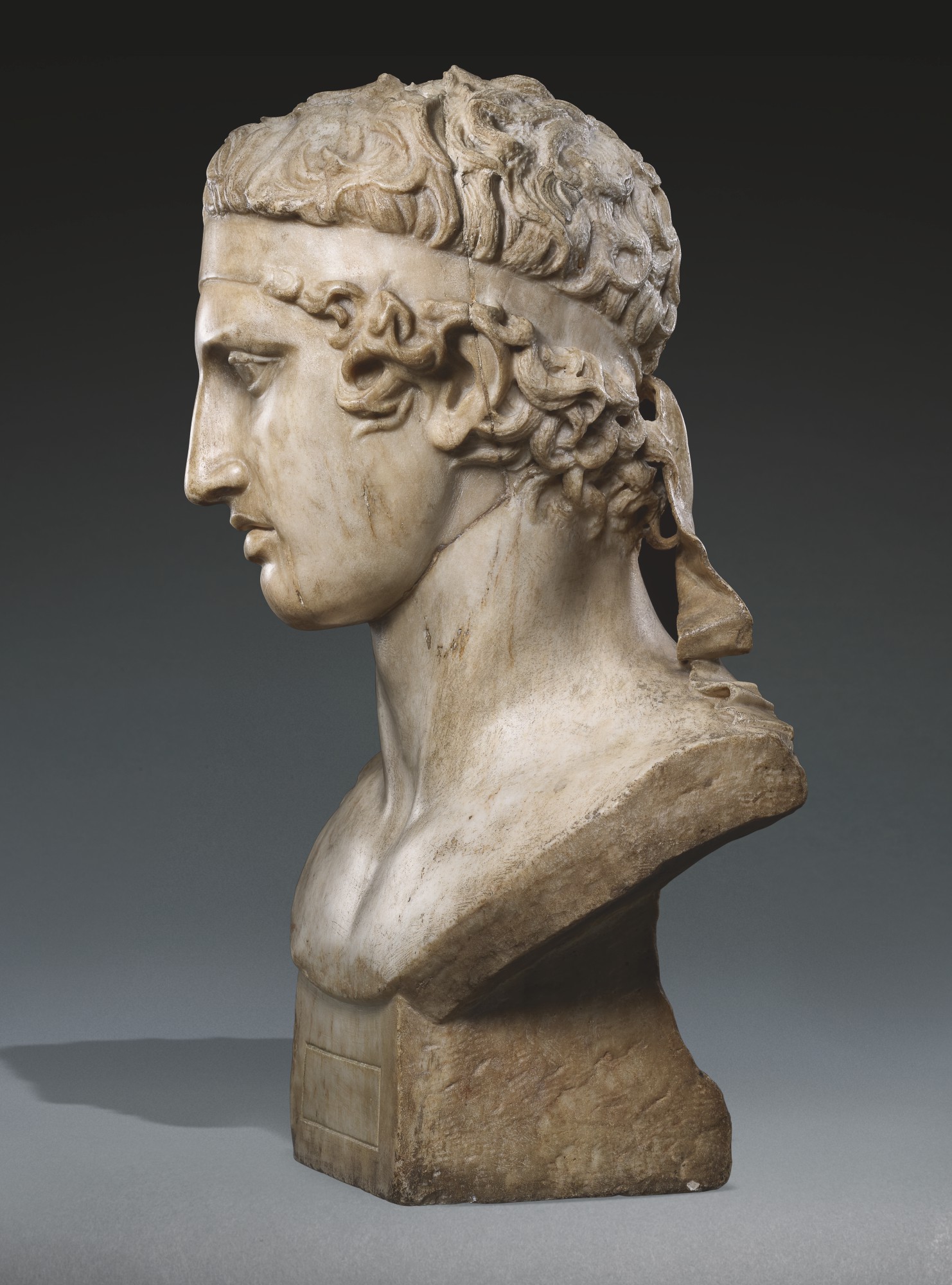 A FRAGMENTARY ROMAN MARBLE HEAD OF THE DIADUMENOS, CIRCA 2ND CENTURY A ...