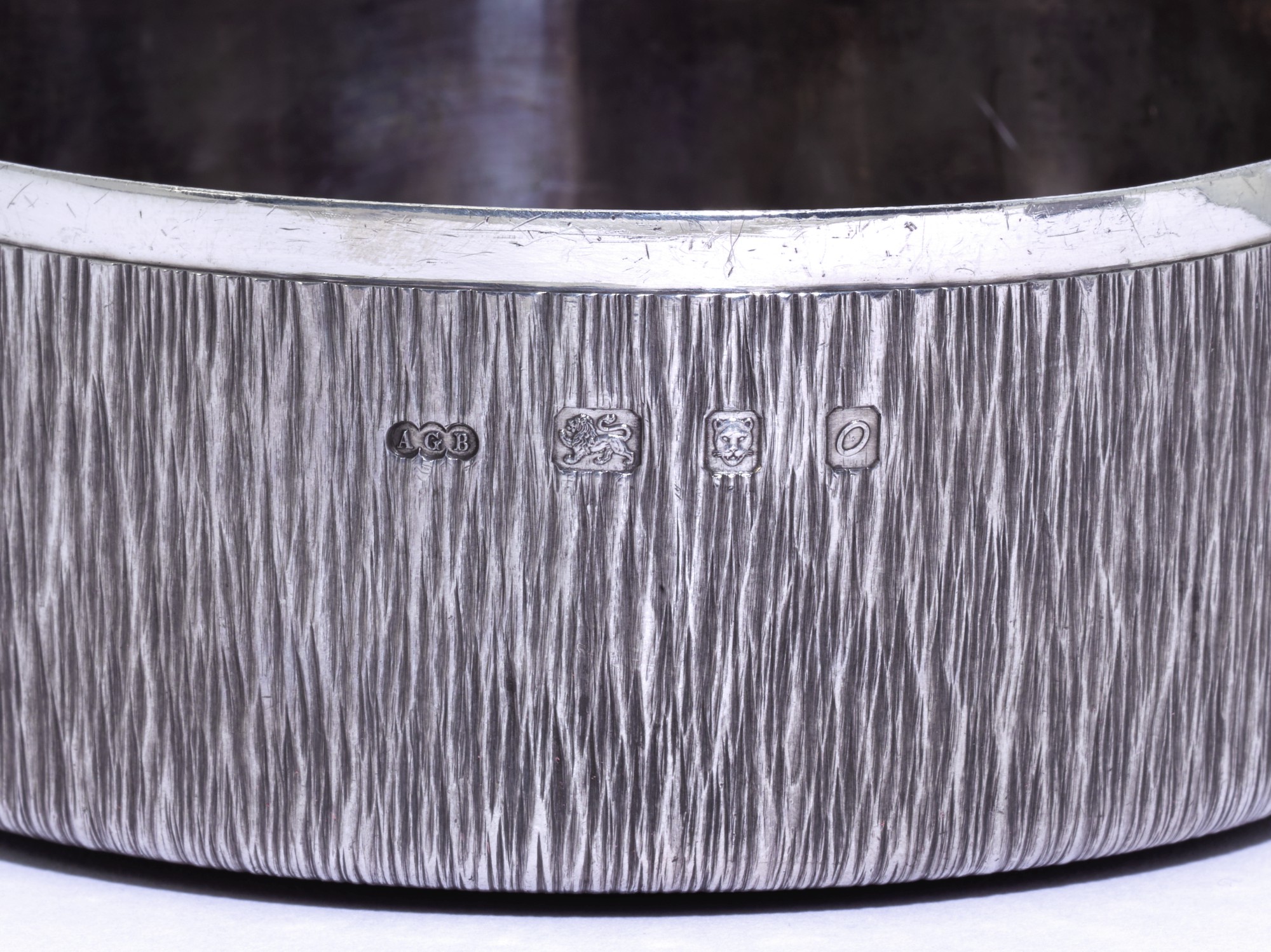 A pair of Elizabeth II silver wine coasters, Gerald Benney, London ...