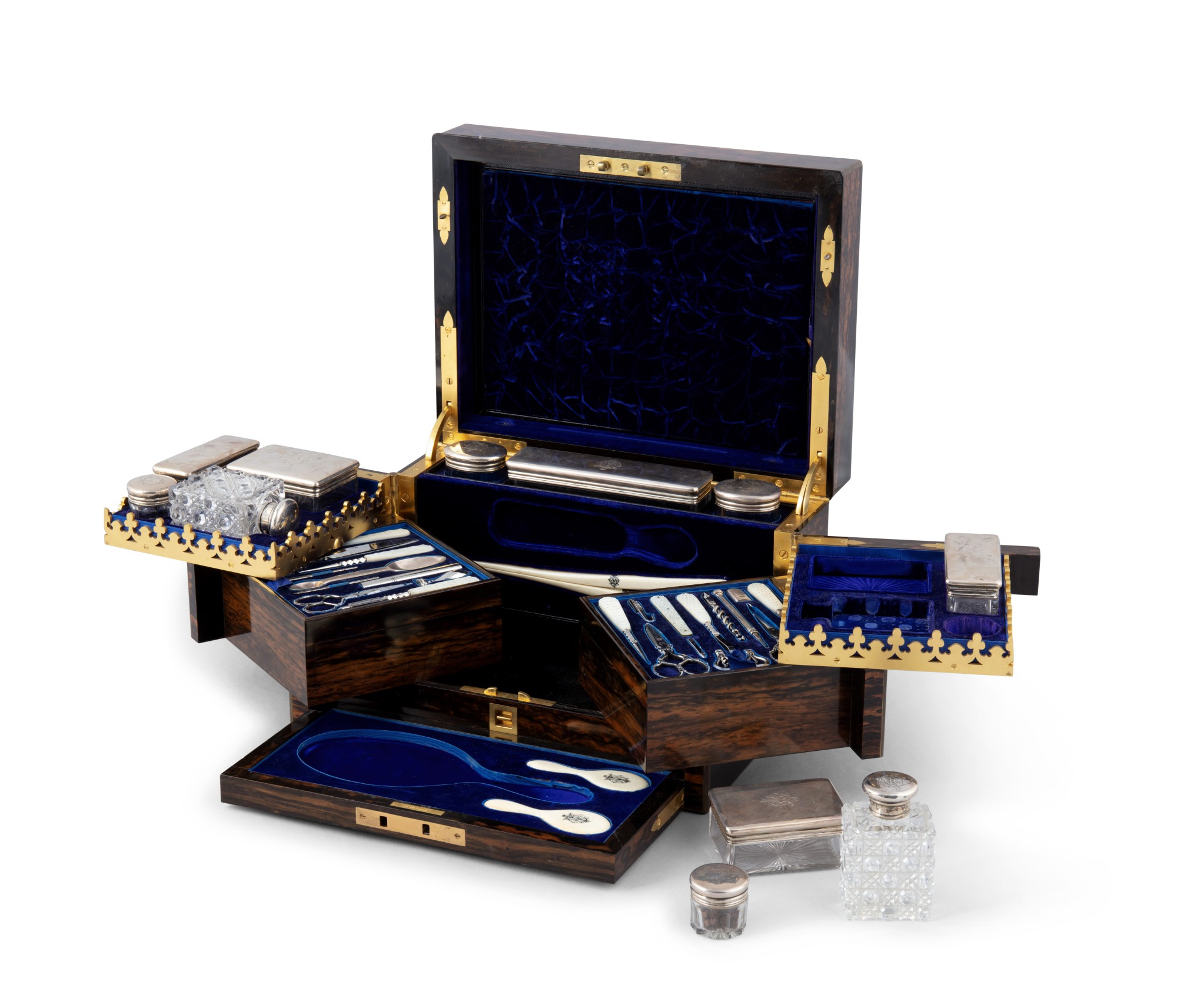 An ebony, brass, ivory, crystal and silver vanity case, English, second ...