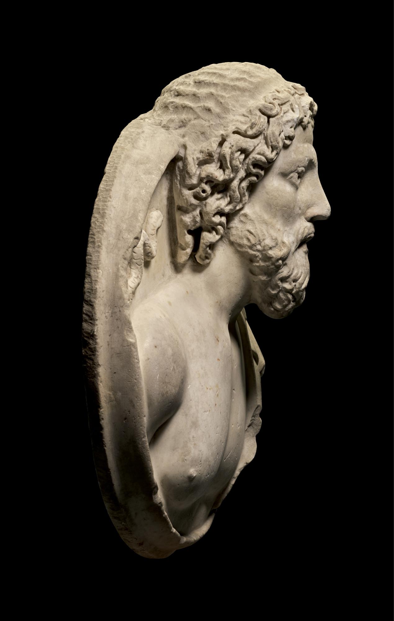 A LATE ROMAN MARBLE CLIPEUS BUST OF ASKLEPIOS, LATE 4TH CENTURY A.D ...