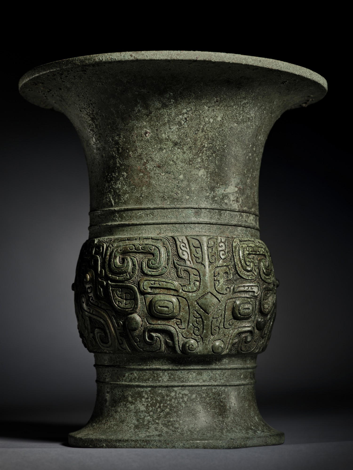 A rare and impressive inscribed archaic bronze ritual wine vessel (Zun ...
