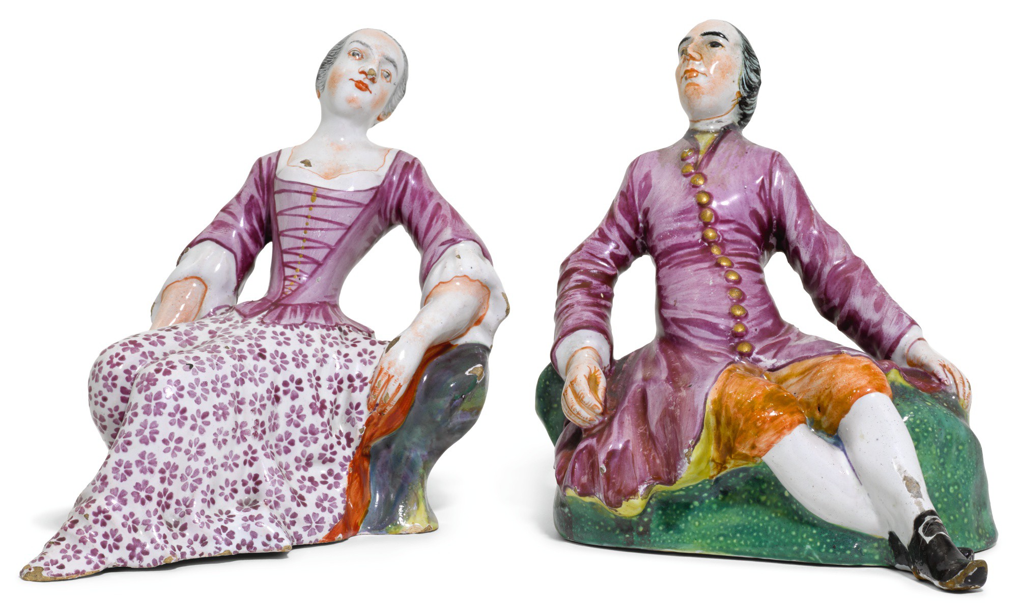 A PAIR OF DUTCH DELFT SEATED FIGURES OF A LADY AND GENTLEMAN, CIRCA ...