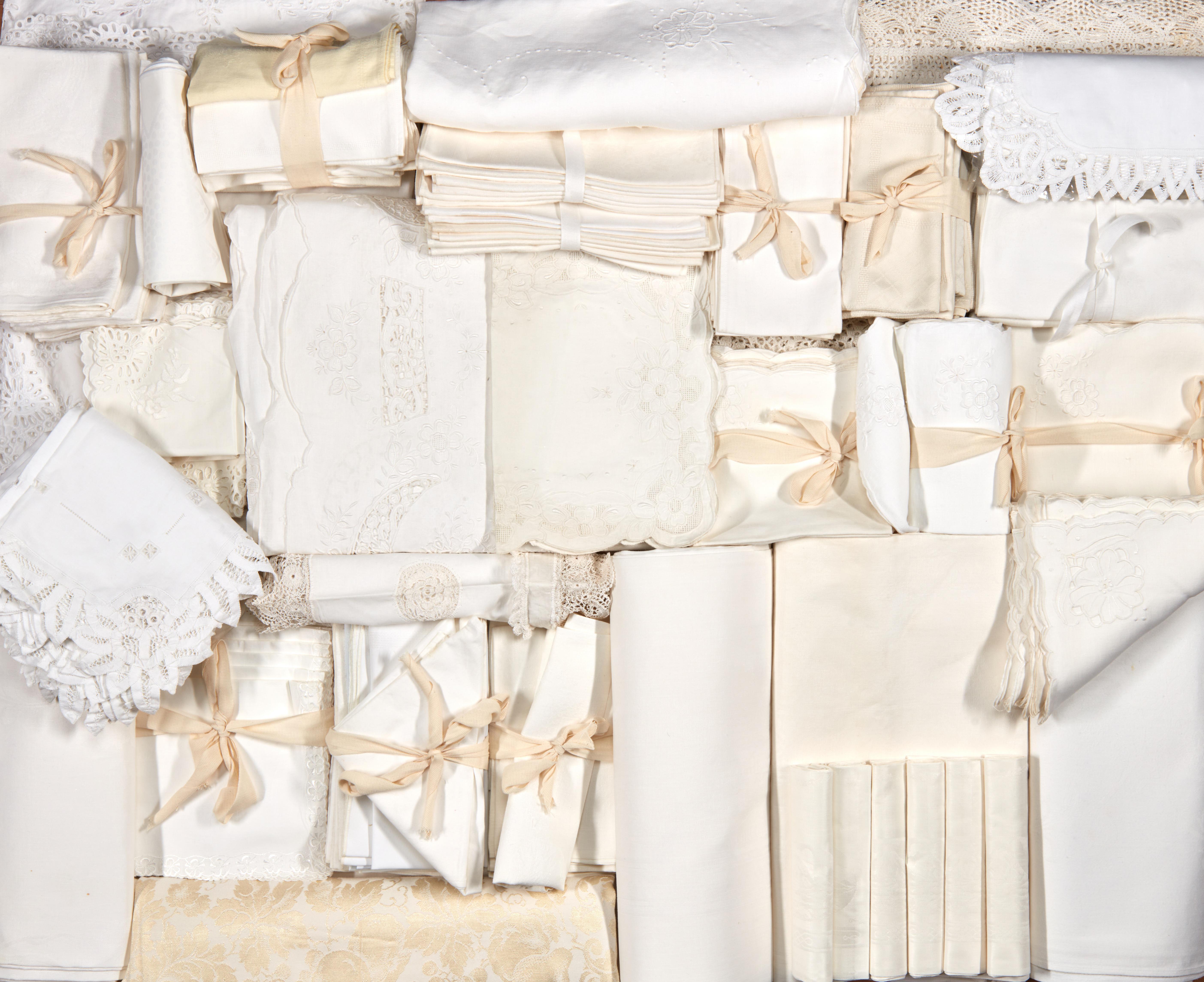A large group of mixed linen damask and cotton domestic table linen ...