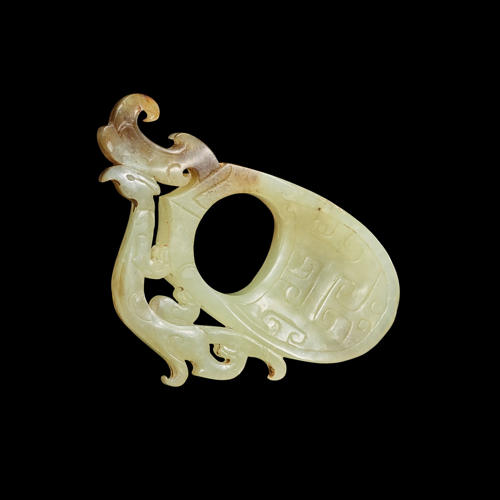 A pale celadon and russet jade 'archer’s ring' ornament, Western Han ...