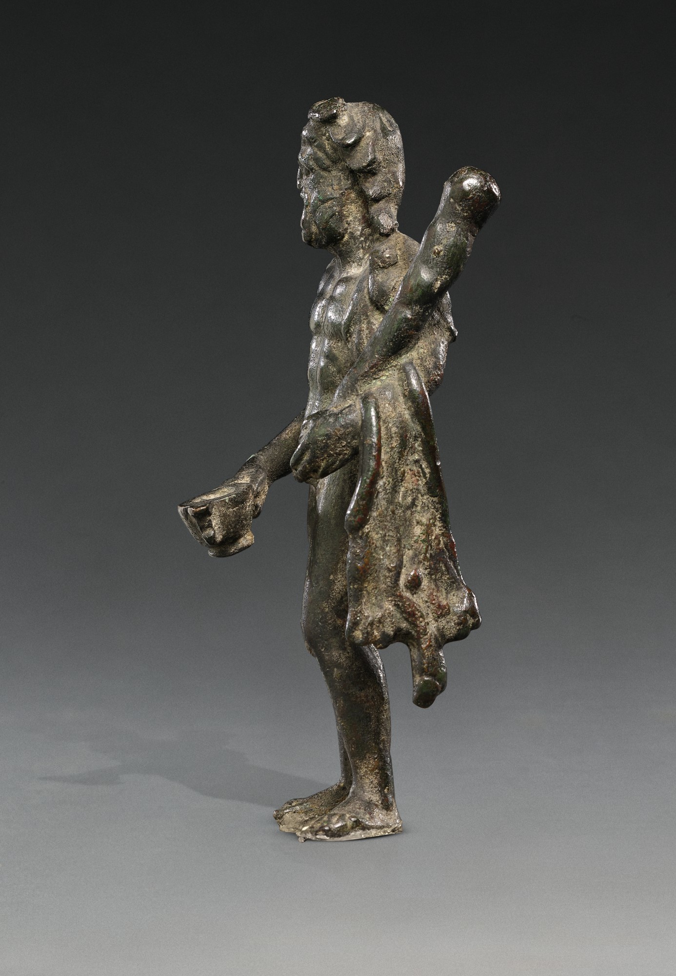 A ROMAN BRONZE FIGURE OF HERAKLES BIBAX, CIRCA 1ST CENTURY A.D ...