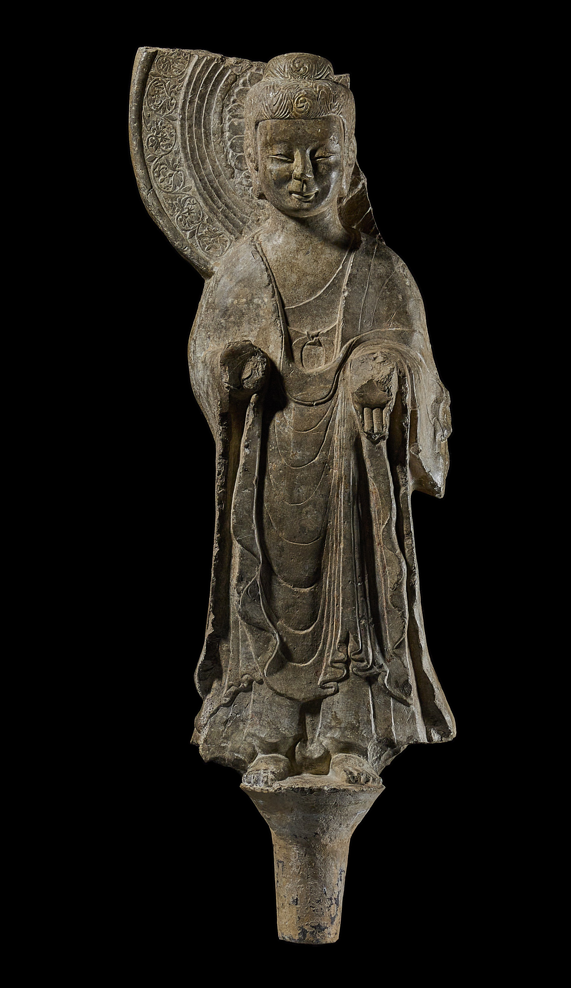 A large carved limestone figure of a Buddha, Northern Qi / Eastern Wei ...