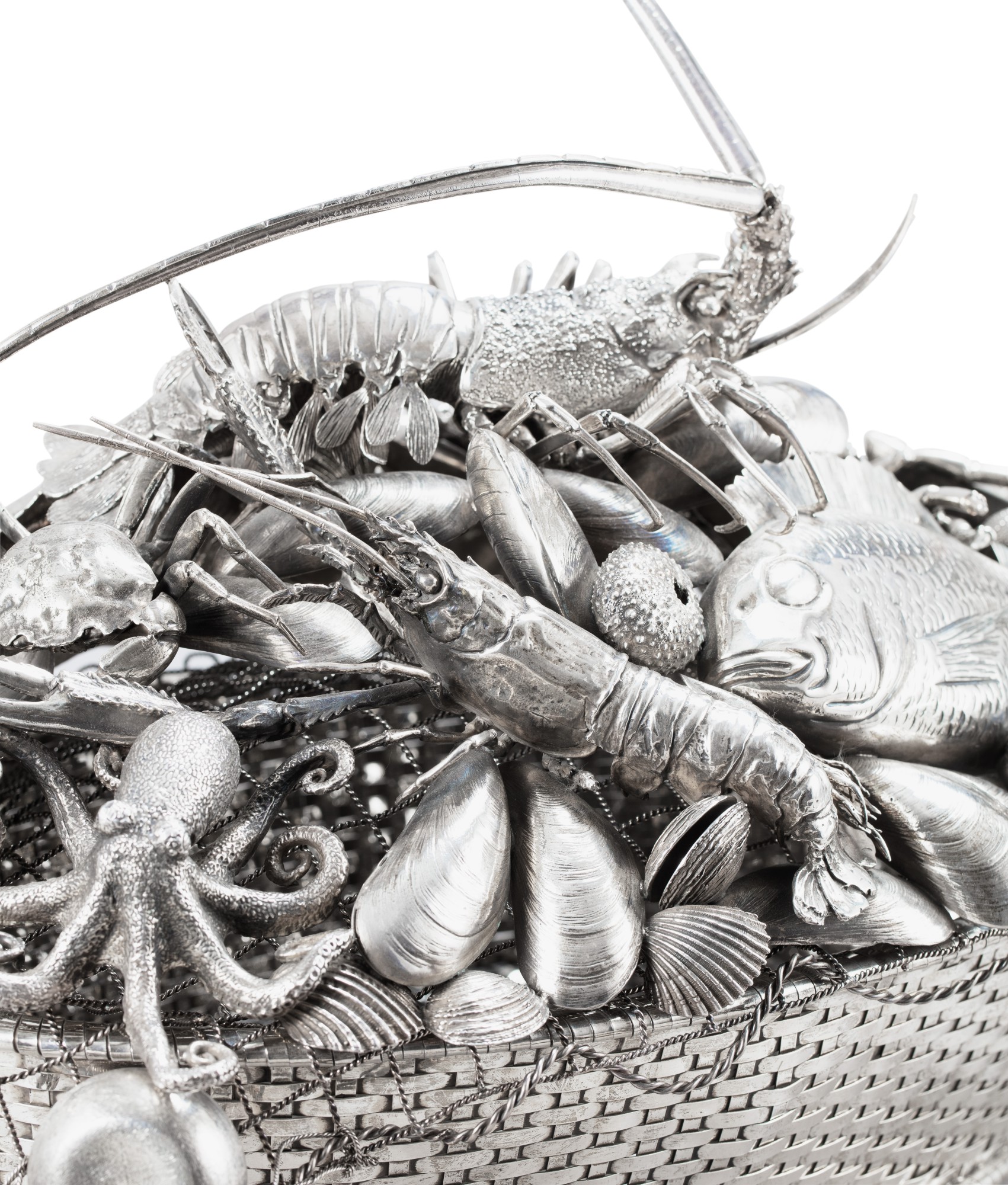 A large Italian silver centretable shaped as a fishing basket, Mario ...