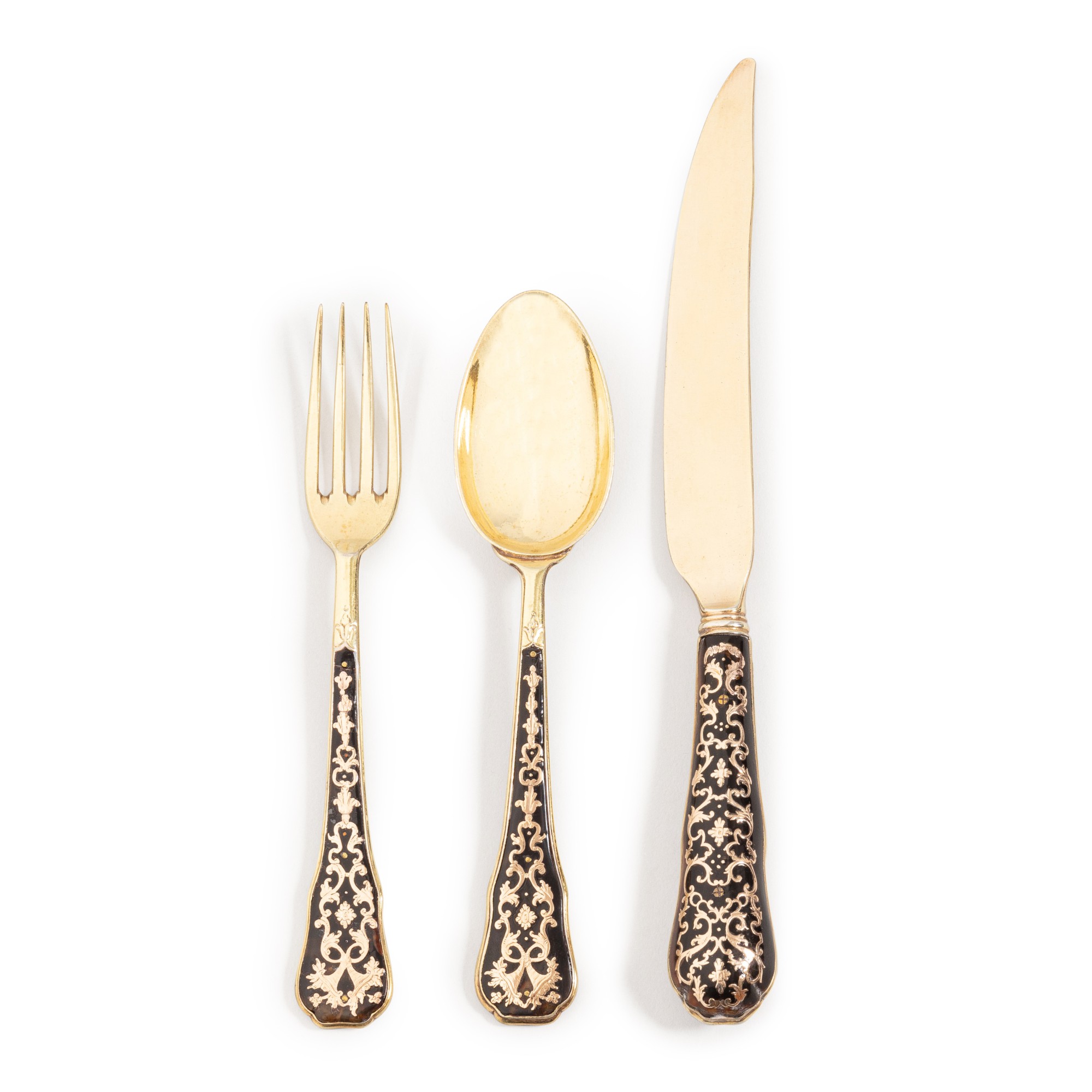 An Italian silver-gilt flatware service with brown tortoiseshell and ...