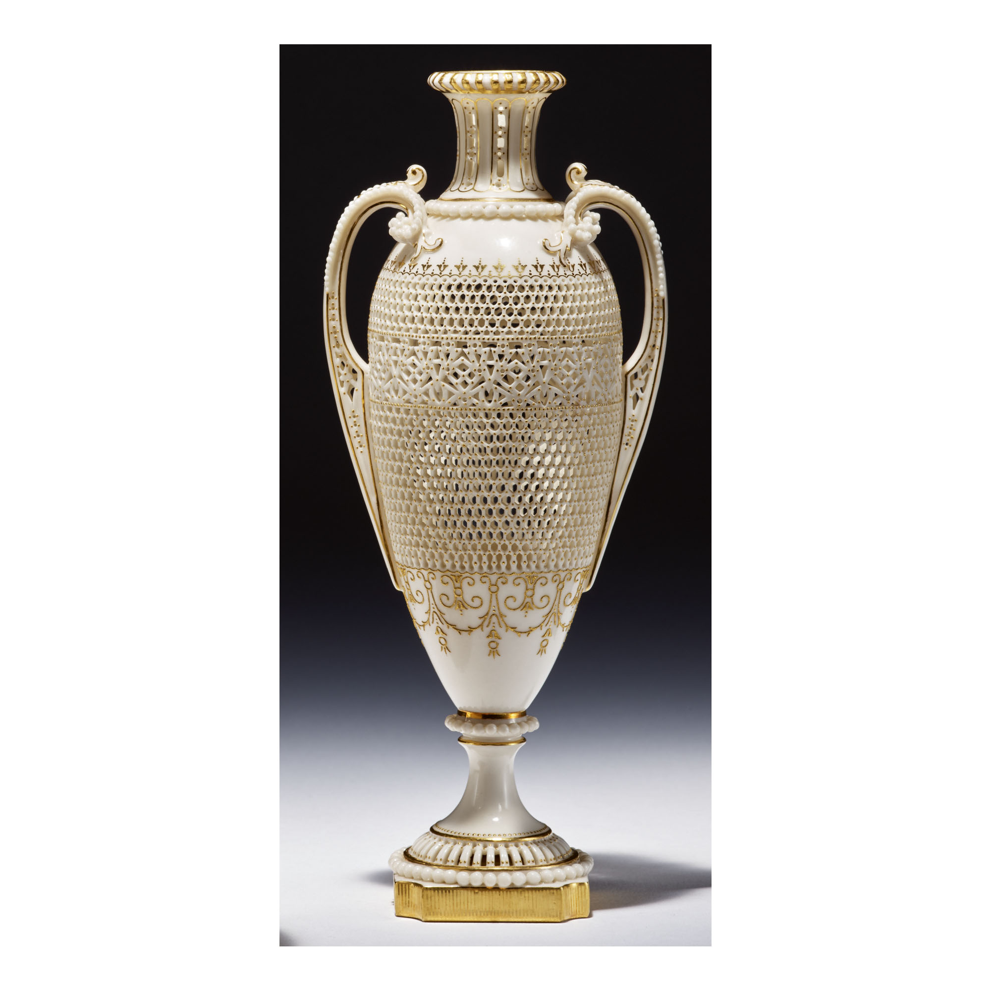A ROYAL WORCESTER RETICULATED PORCELAIN TWO-HANDLED VASE BY GEORGE OWEN ...