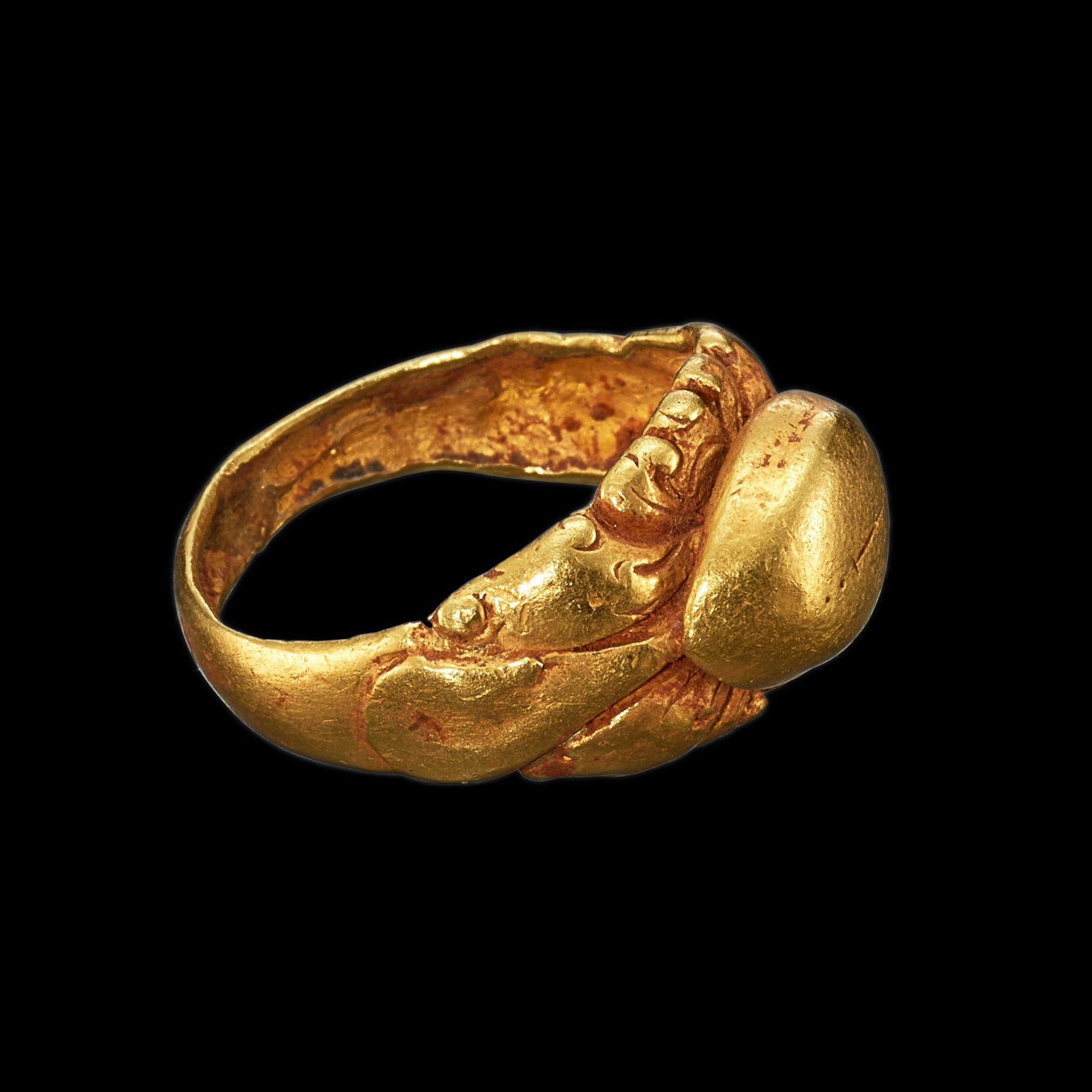 A solid gold ring with floral shank and engraved 'Ankusa' symbol Java ...