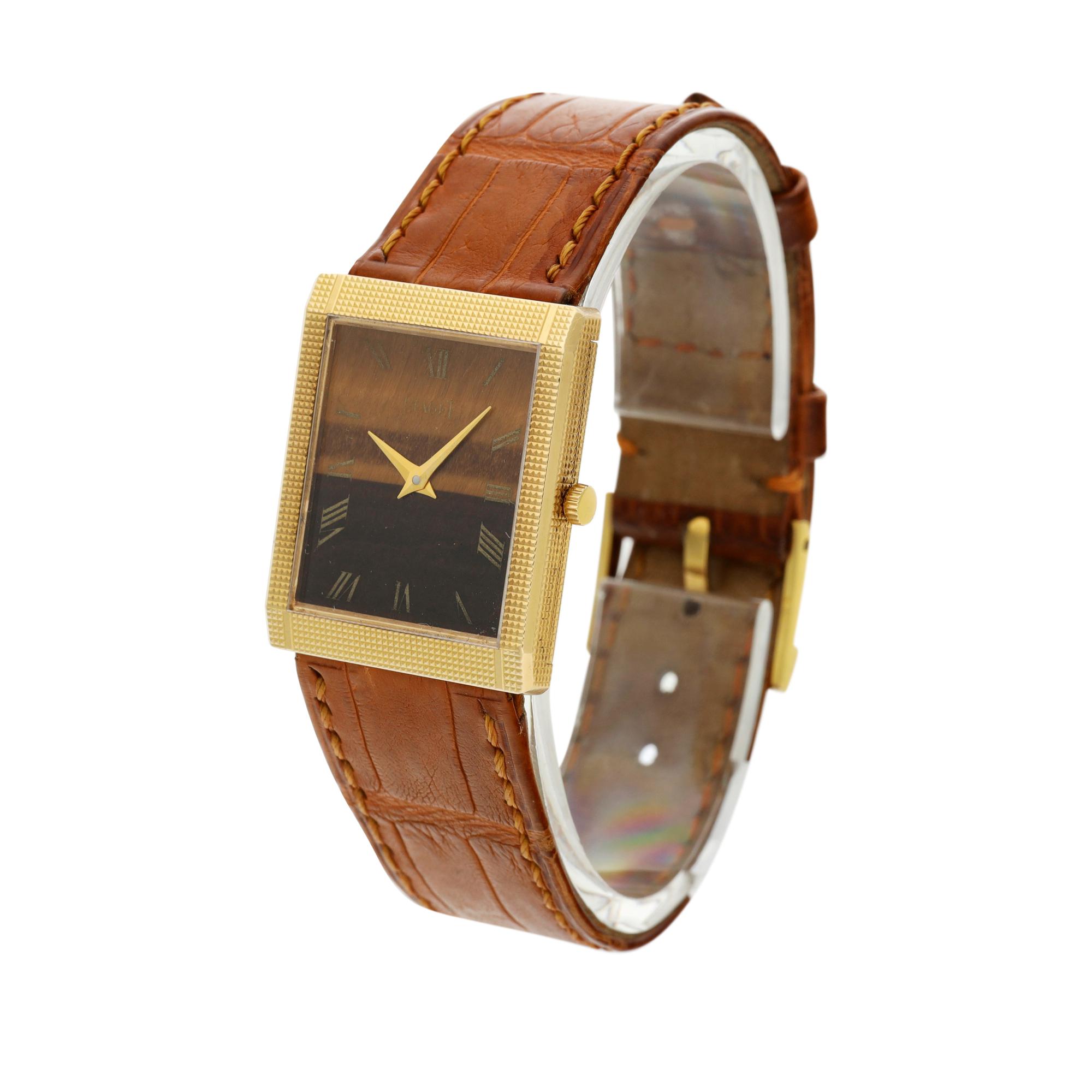 Reference 9151, A yellow gold rectangular wristwatch with tiger's eye ...