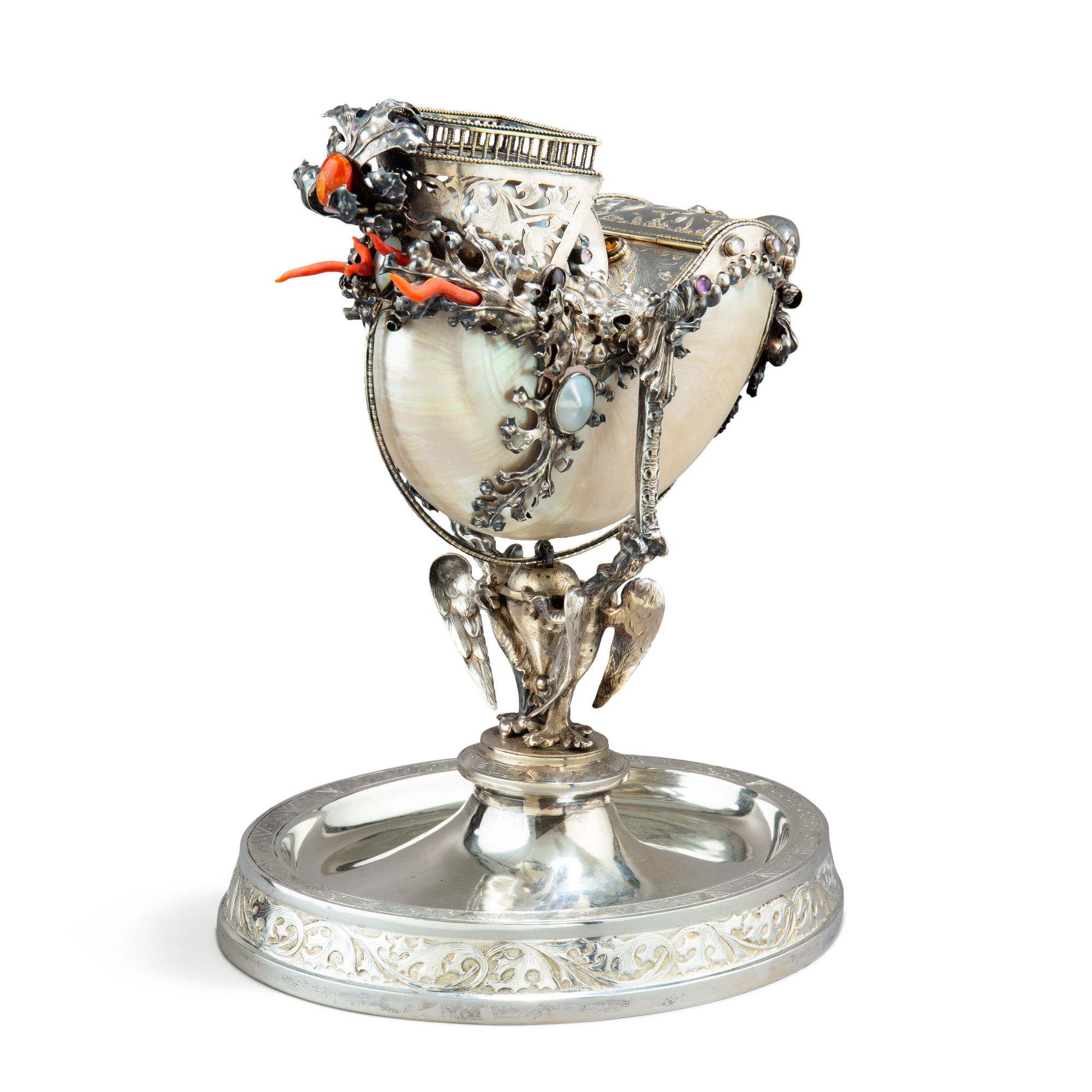 An Austrian nautilus shell cup with silver mounts, red coral and semi ...
