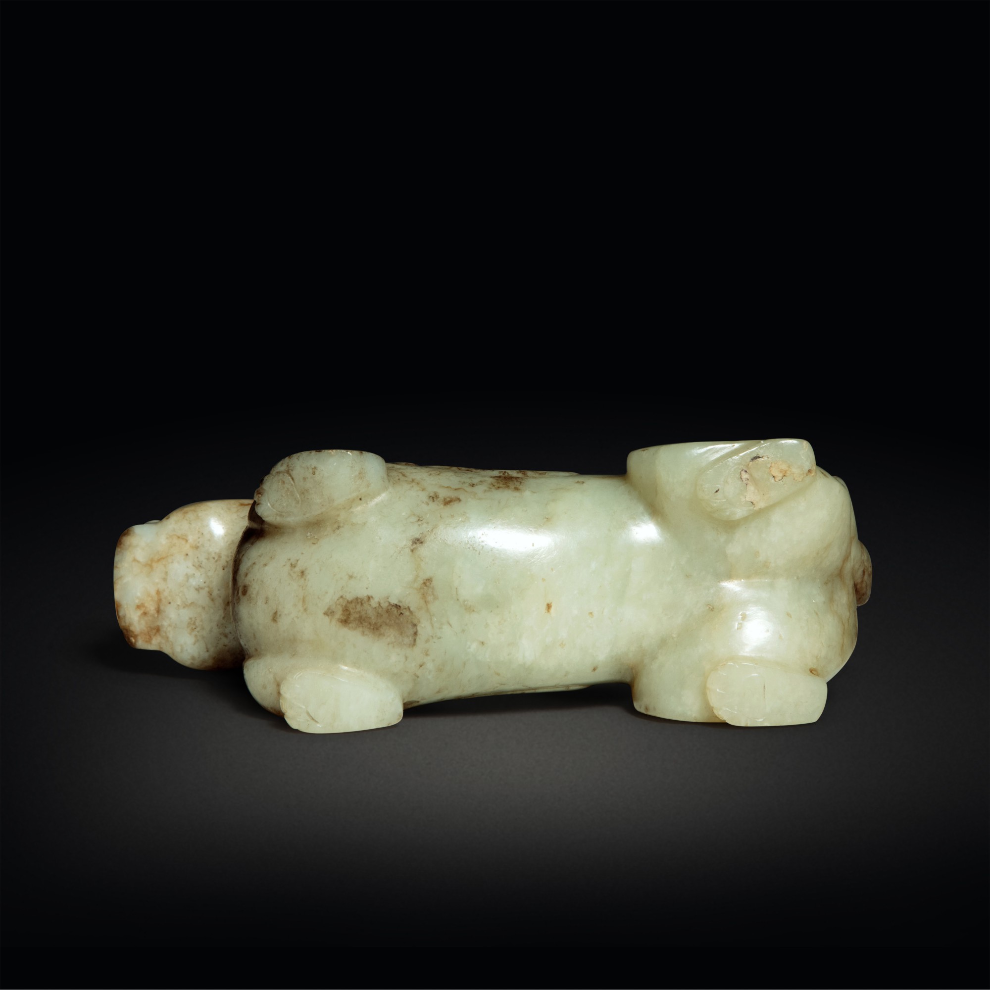 A beige and brown jade figure of a bixie, Ming dynasty or later | 明或以後 ...