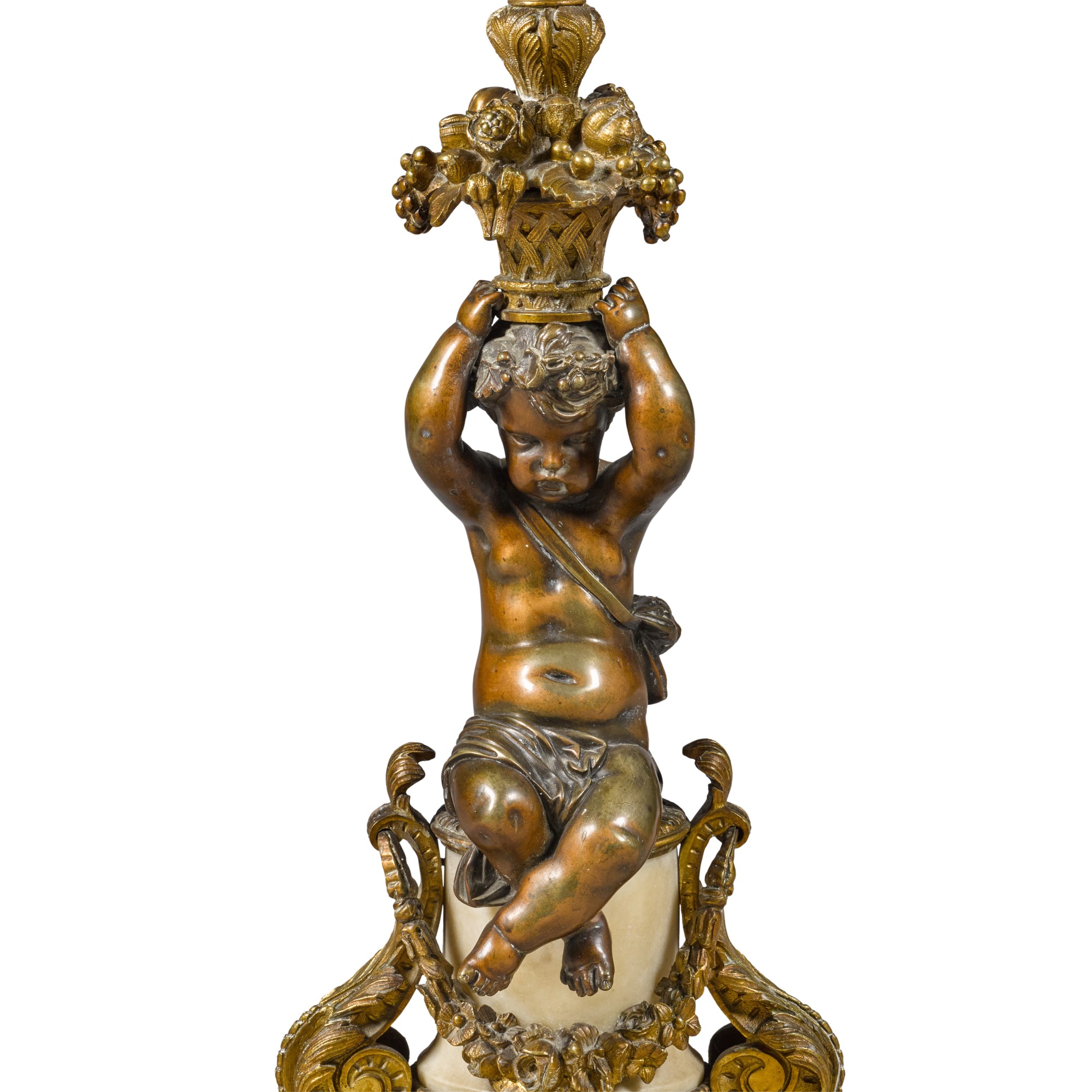 A pair of patinated and gilt bronze six-light candelabra | Monte ...