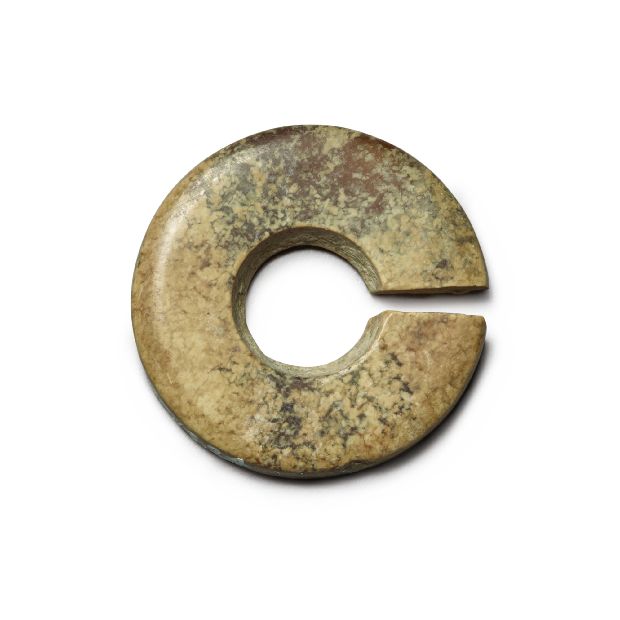A calcified jade slit disc (Jue), Neolithic period / Shang dynasty ...