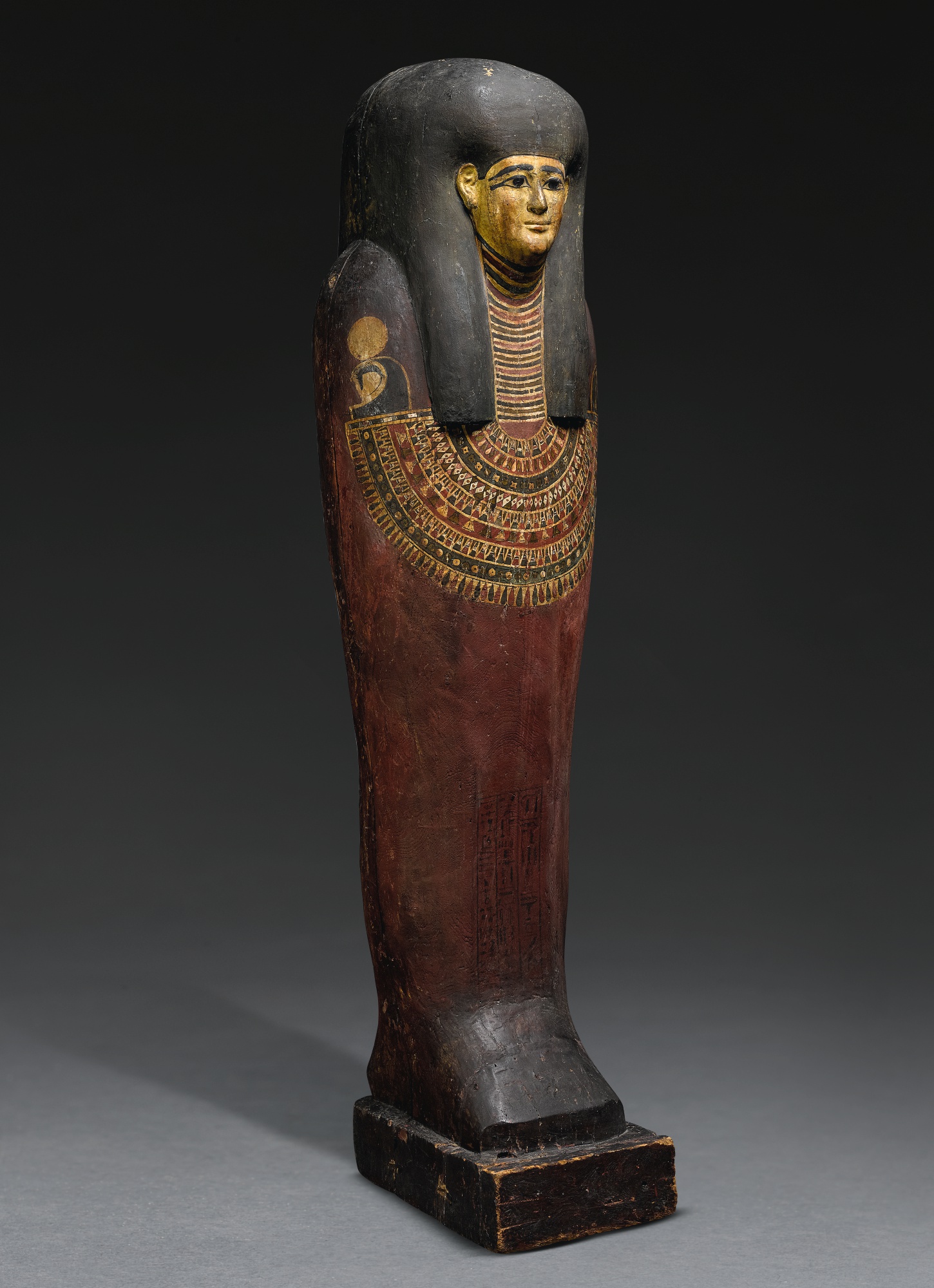 AN EGYPTIAN POLYCHROME AND GILT ANTHROPOID INNER COFFIN OF THE SISTRUM ...