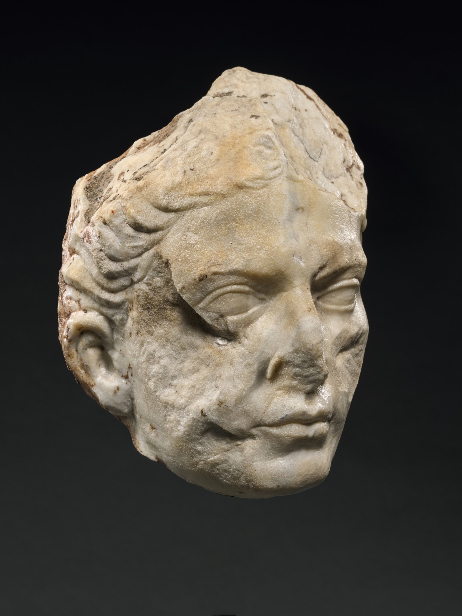 A FRAGMENTARY ROMAN MARBLE PORTRAIT HEAD OF A WOMAN, LATE AUGUSTAN ...