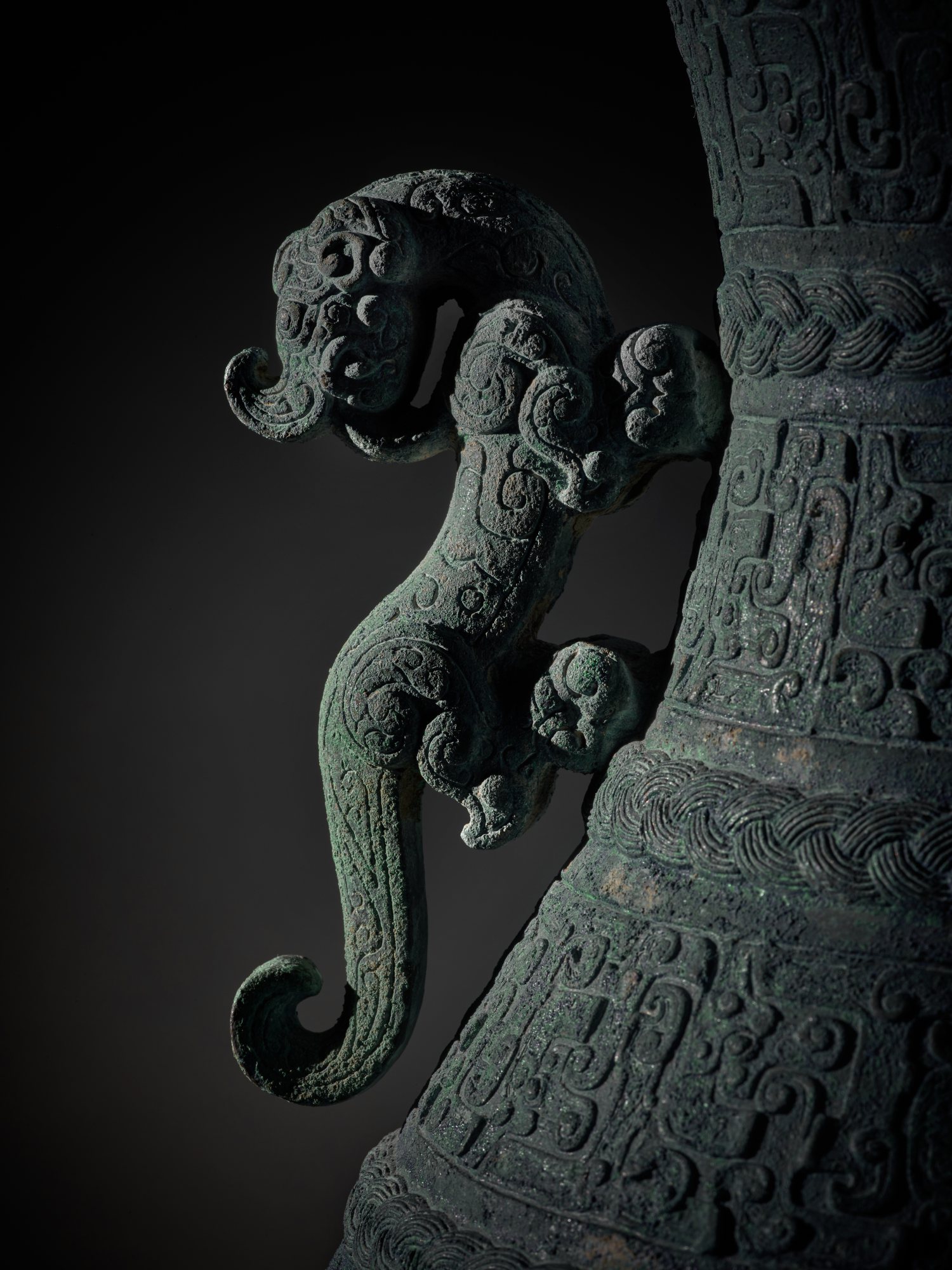 An exceptional and rare archaic bronze wine vessel (Hu), Eastern Zhou ...