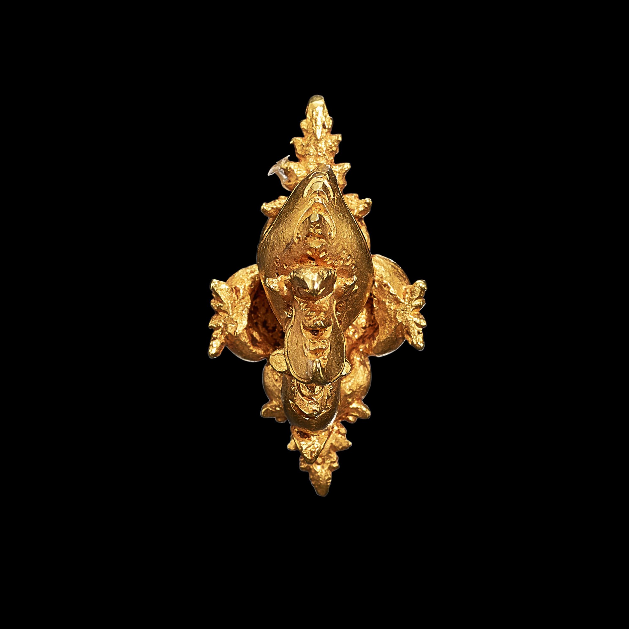 An elaborate solid gold earring Java, Indonesia, 7th - 12th century ...