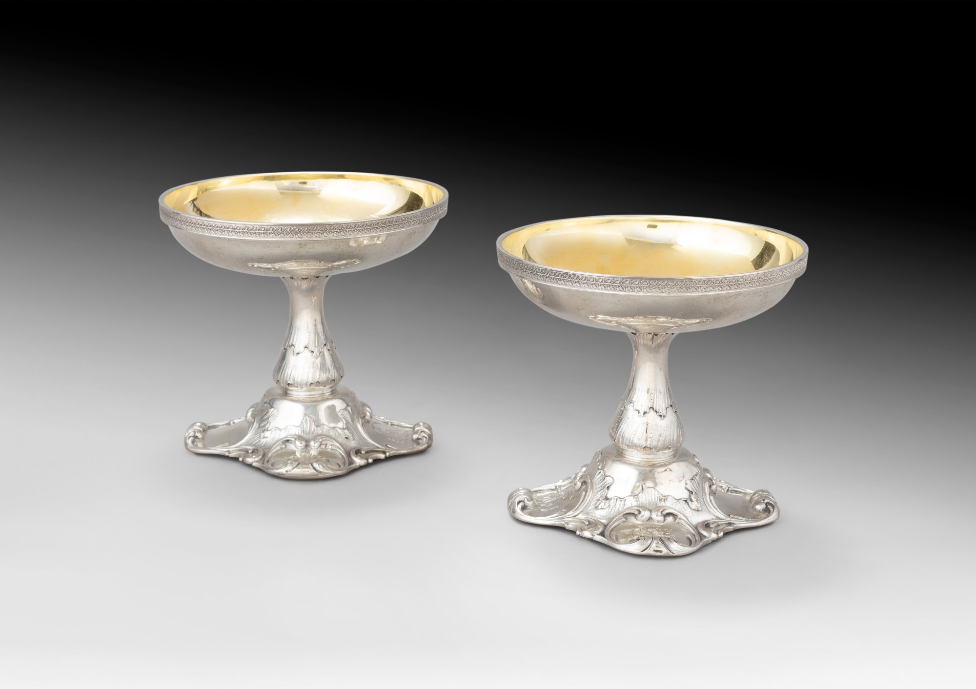 A pair of circular silver and silver-gilt cups, Saint Petersburg, circa ...