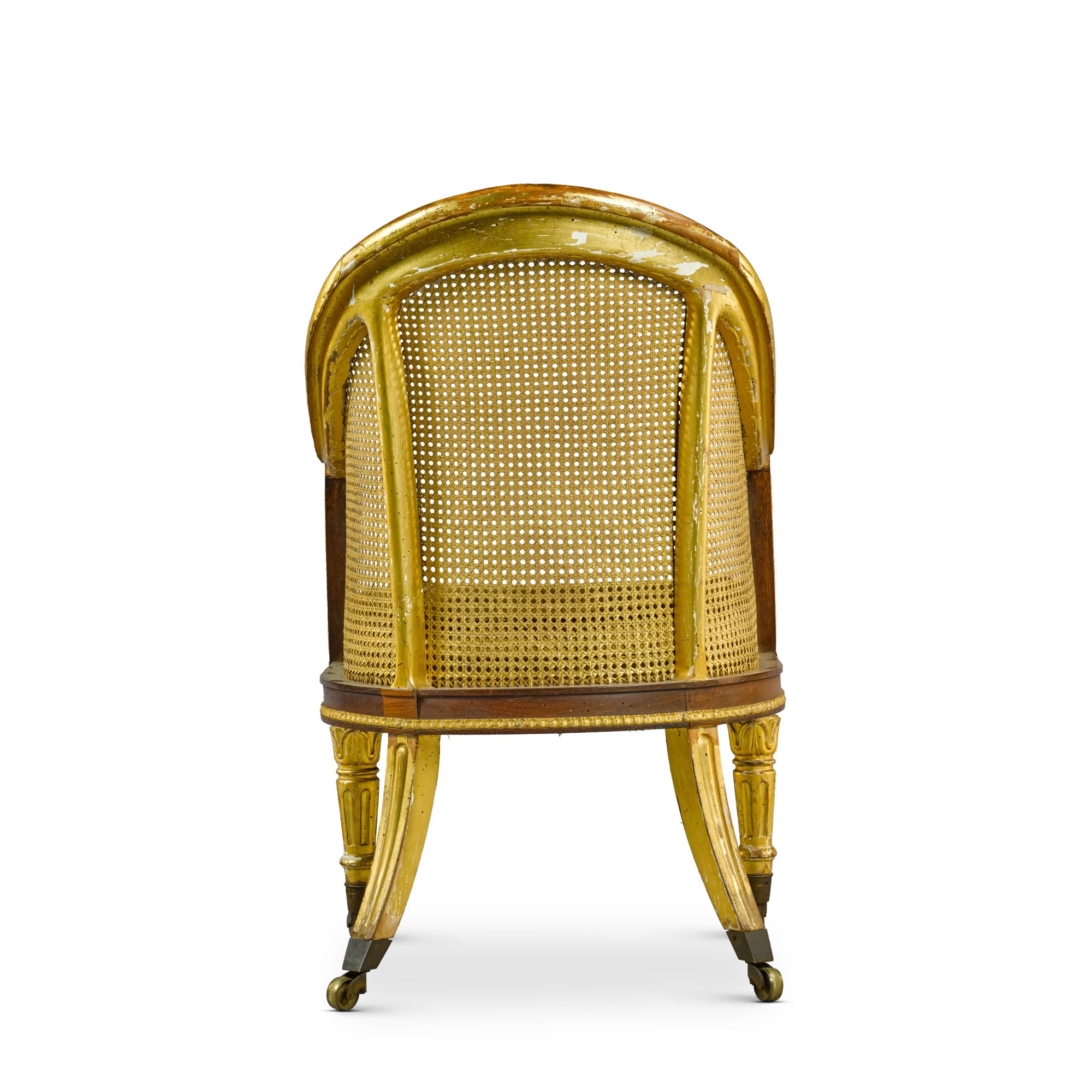 A pair of Regency simulated rosewood and parcel-gilt caned tub chairs ...