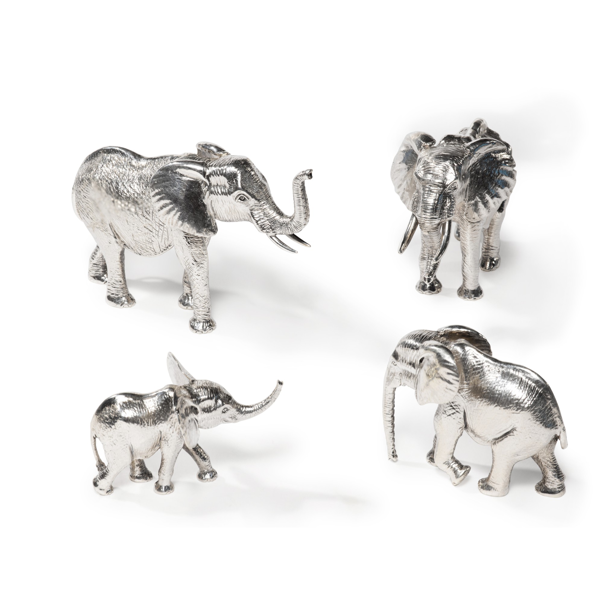 A Zimbabwean Silver Acacia Tree Two-Light Candelabrum and Nine ...