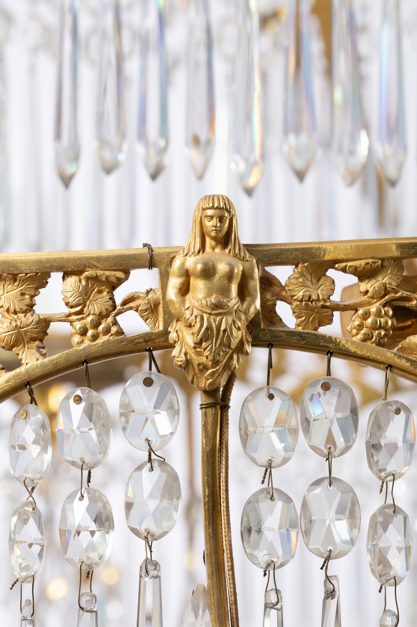 A GERMAN NEOCLASSICAL GILT-BRONZE AND CUT-CRYSTAL CHANDELIER ATTRIBUTED ...
