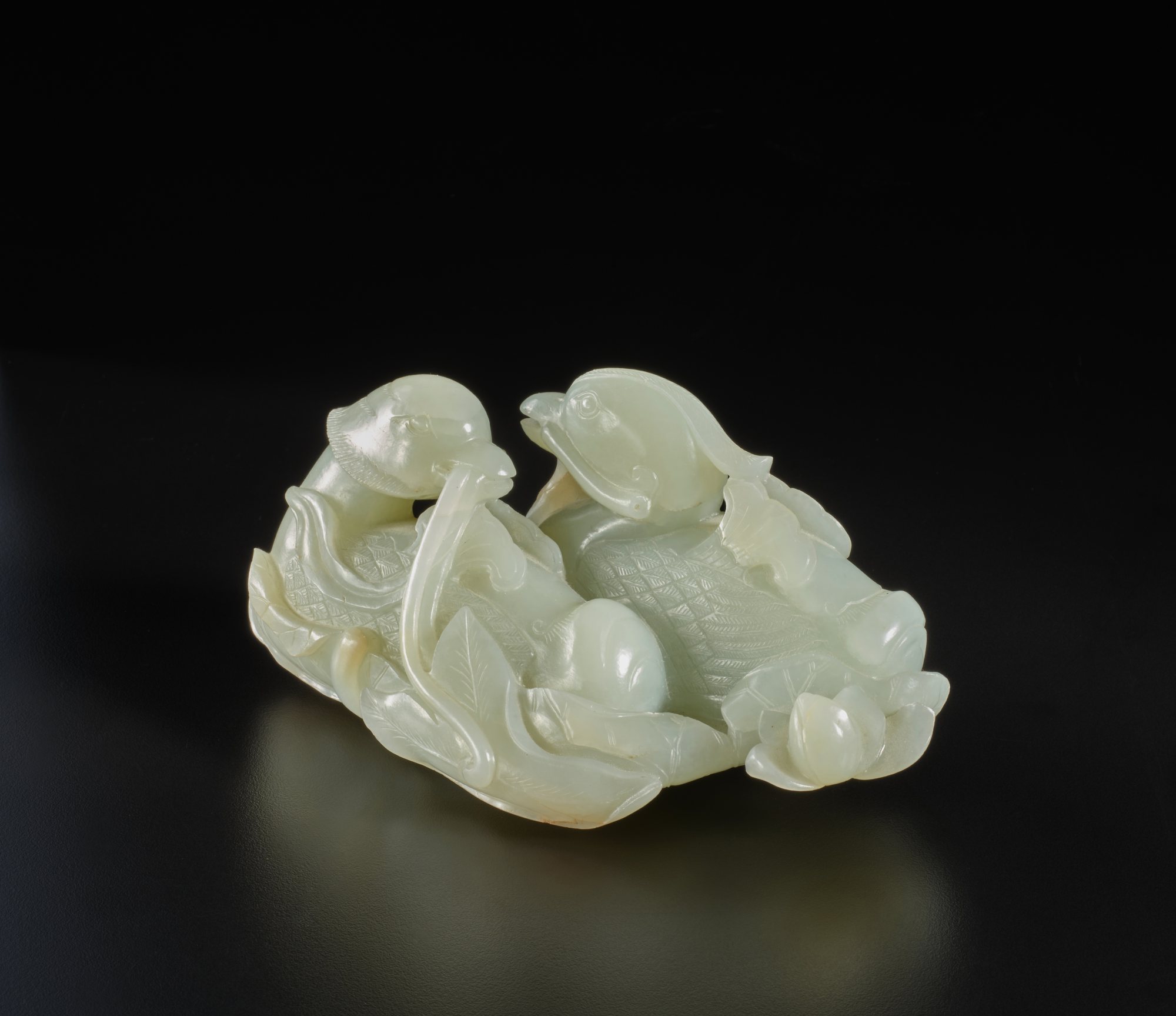 A large pale celadon jade 'mandarin ducks and lotus' group, Qing ...