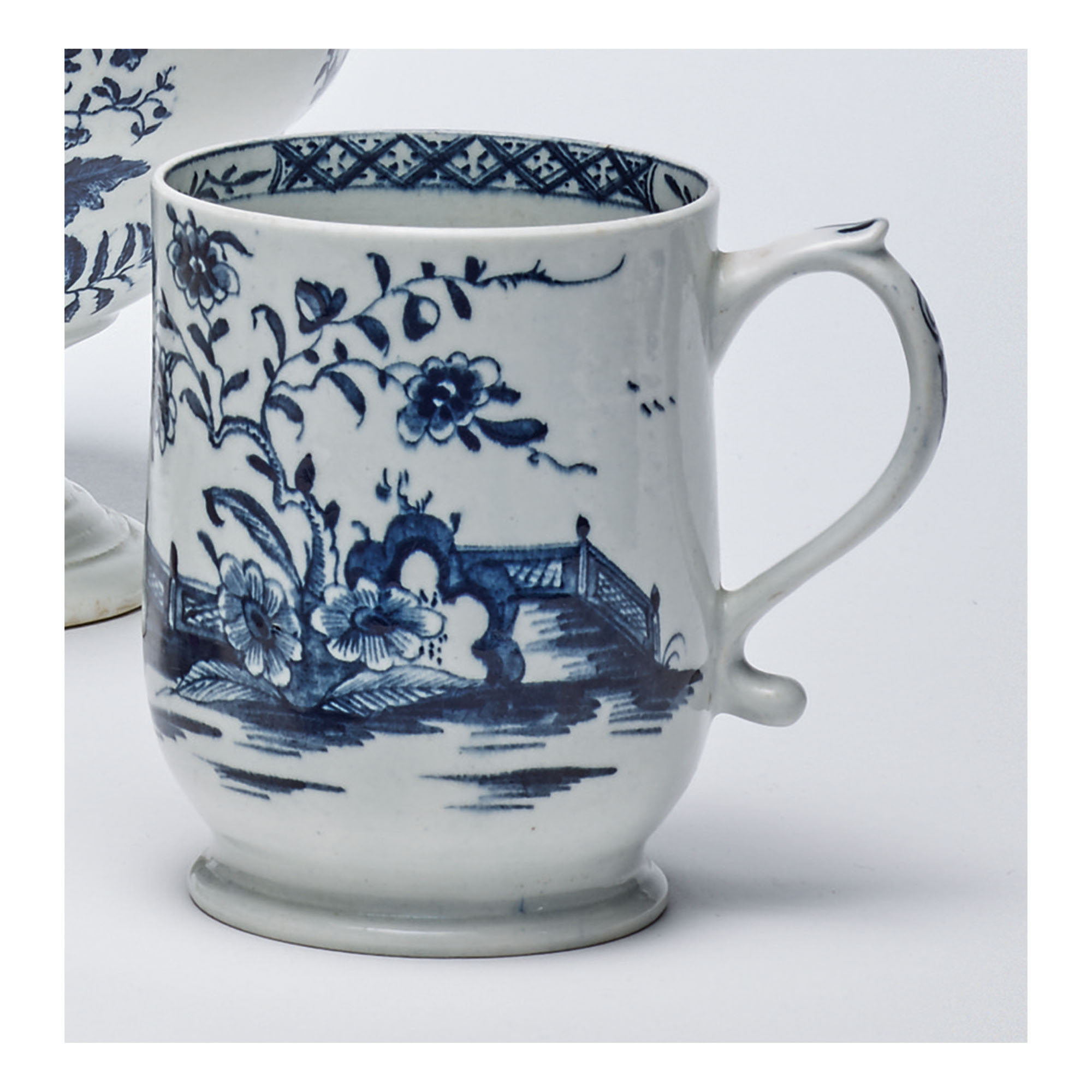 A LOWESTOFT PORCELAIN BLUE AND WHITE BELL-SHAPED MUG CIRCA 1765 ...