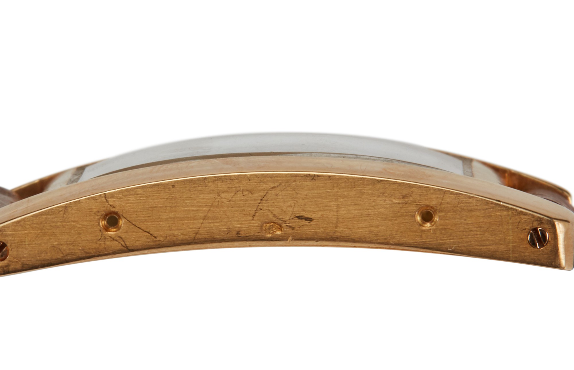 Tank Cintrée, A rare yellow gold rectangular wristwatch, Circa 1965 卡地亞 ...