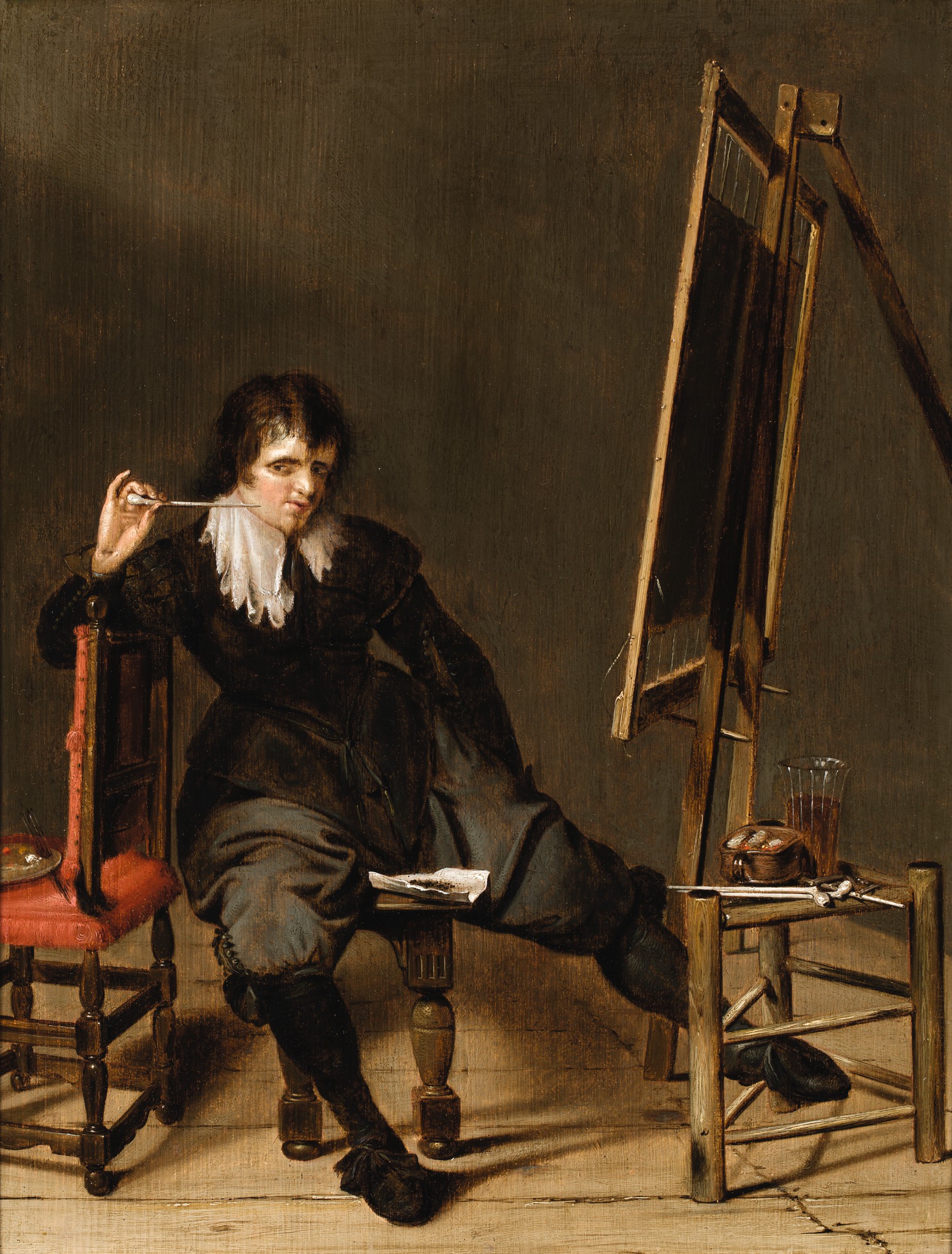 PIETER CODDE | AN ARTIST IN HIS STUDIO, SEATED ON A STOOL, IN FRONT OF ...