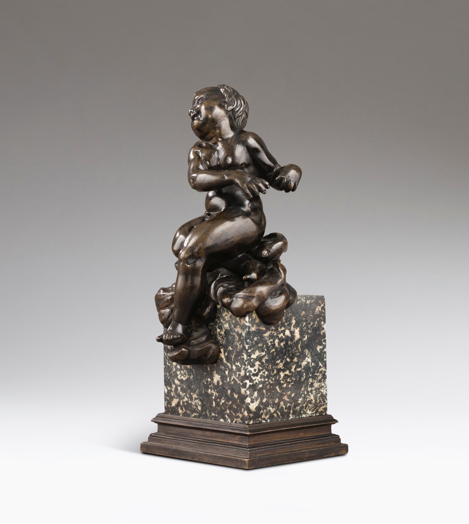 Putto seated on a rock | Putto assis sur un rocher | Treasures of the ...