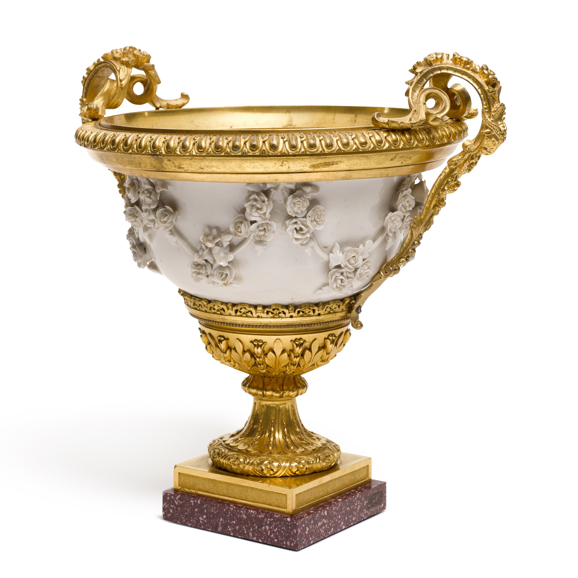 A French gilt-bronze mounted white porcelain and porphyry bowl, the ...