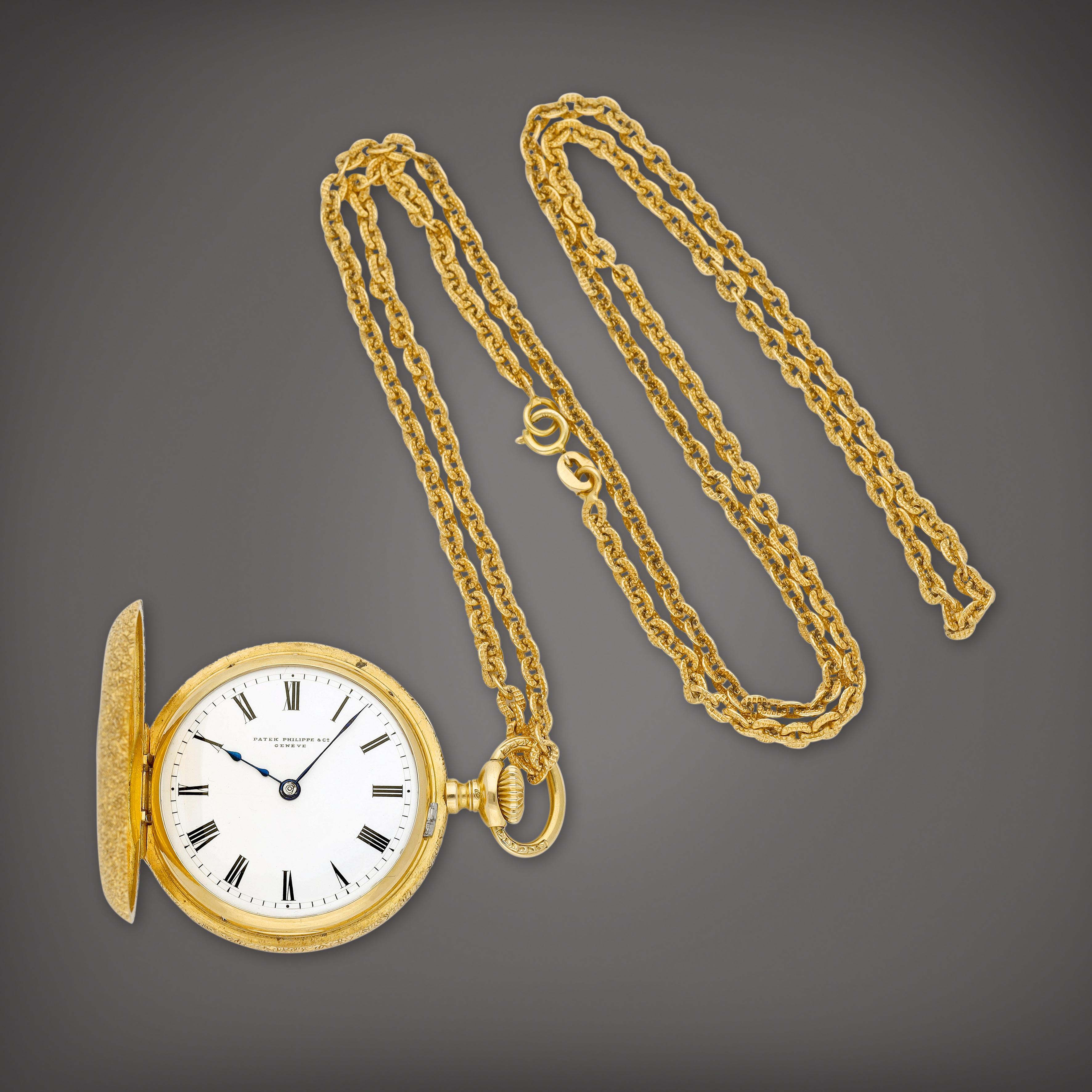 A yellow gold hunting case keyless watch with enamel dial and chain ...