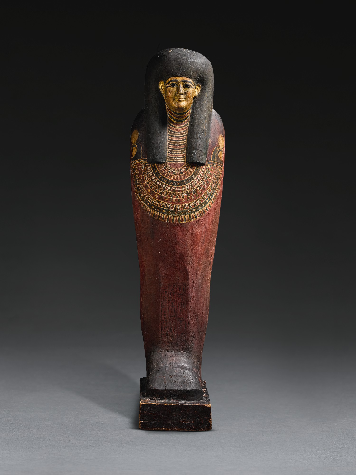 AN EGYPTIAN POLYCHROME AND GILT ANTHROPOID INNER COFFIN OF THE SISTRUM ...