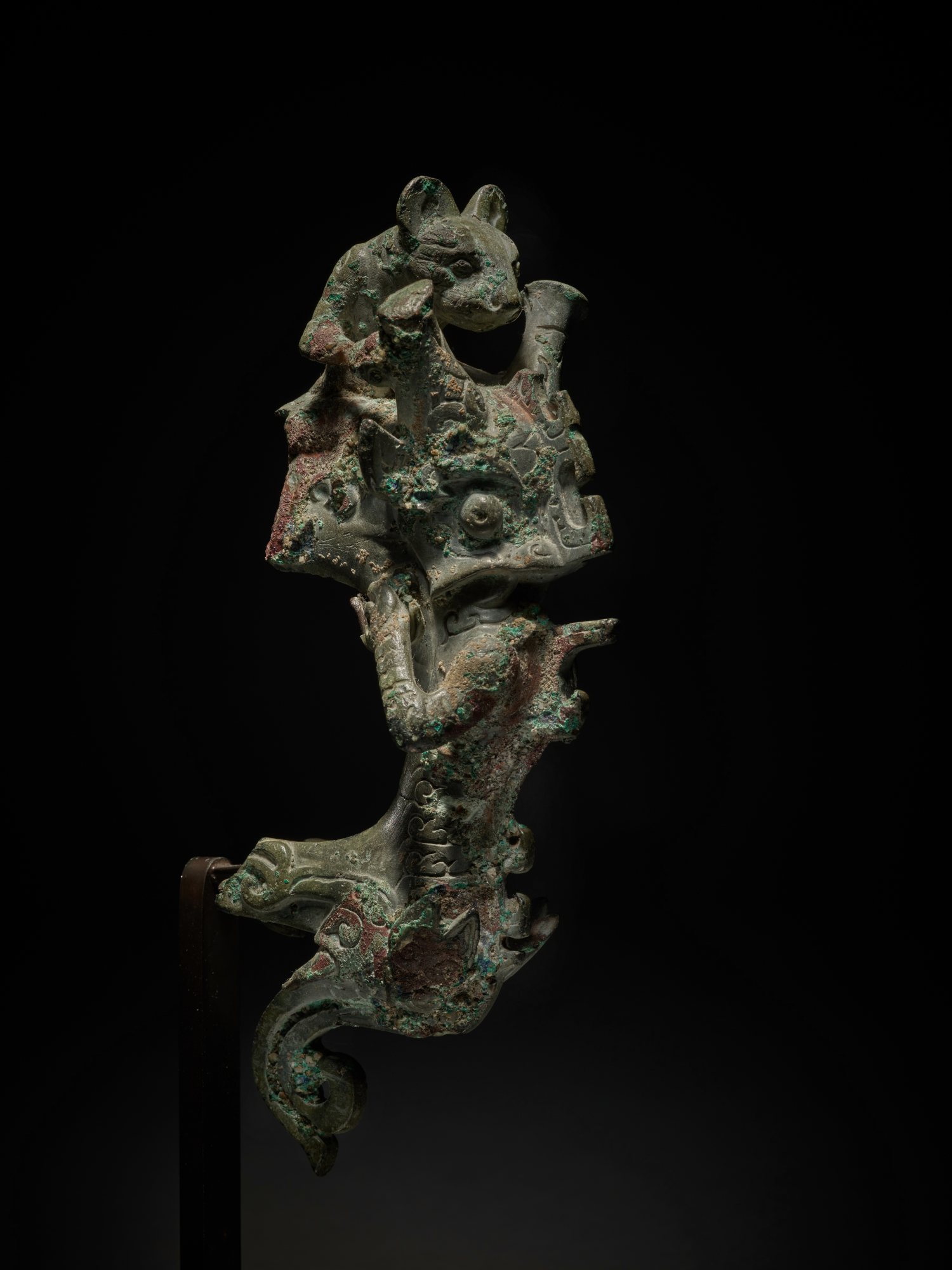 An exceptional and rare archaic bronze 'mythical beast' handle, Late ...