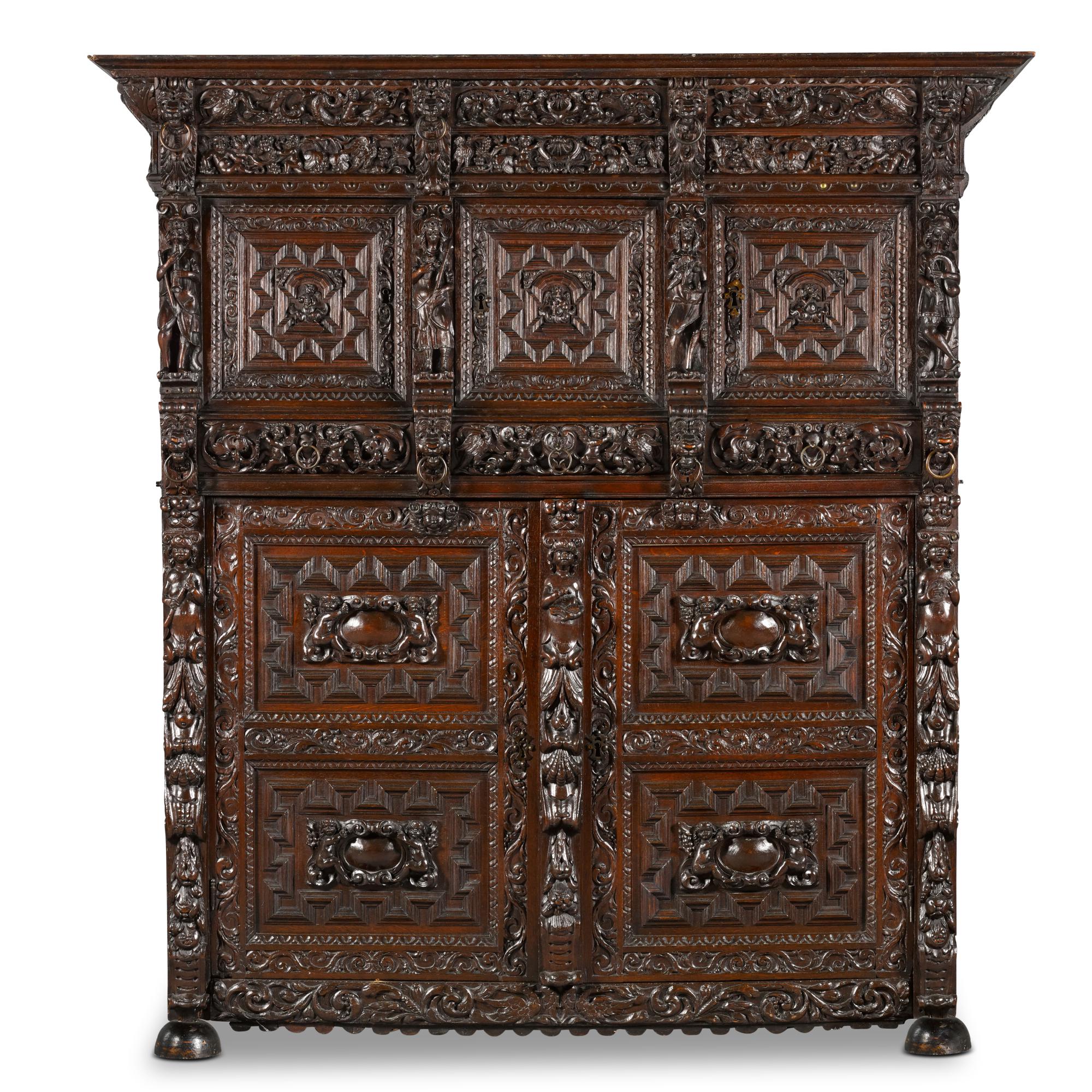 A Flemish Renaissance style carved stained oak cabinet (buffet à cinq ...