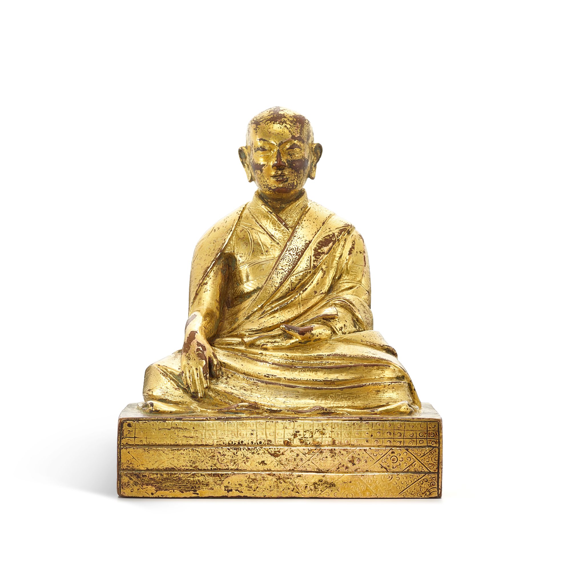 A gilt-bronze figure of a lama, Tibet, 18th century 十八世紀 藏傳鎏金銅喇嘛坐像 ...