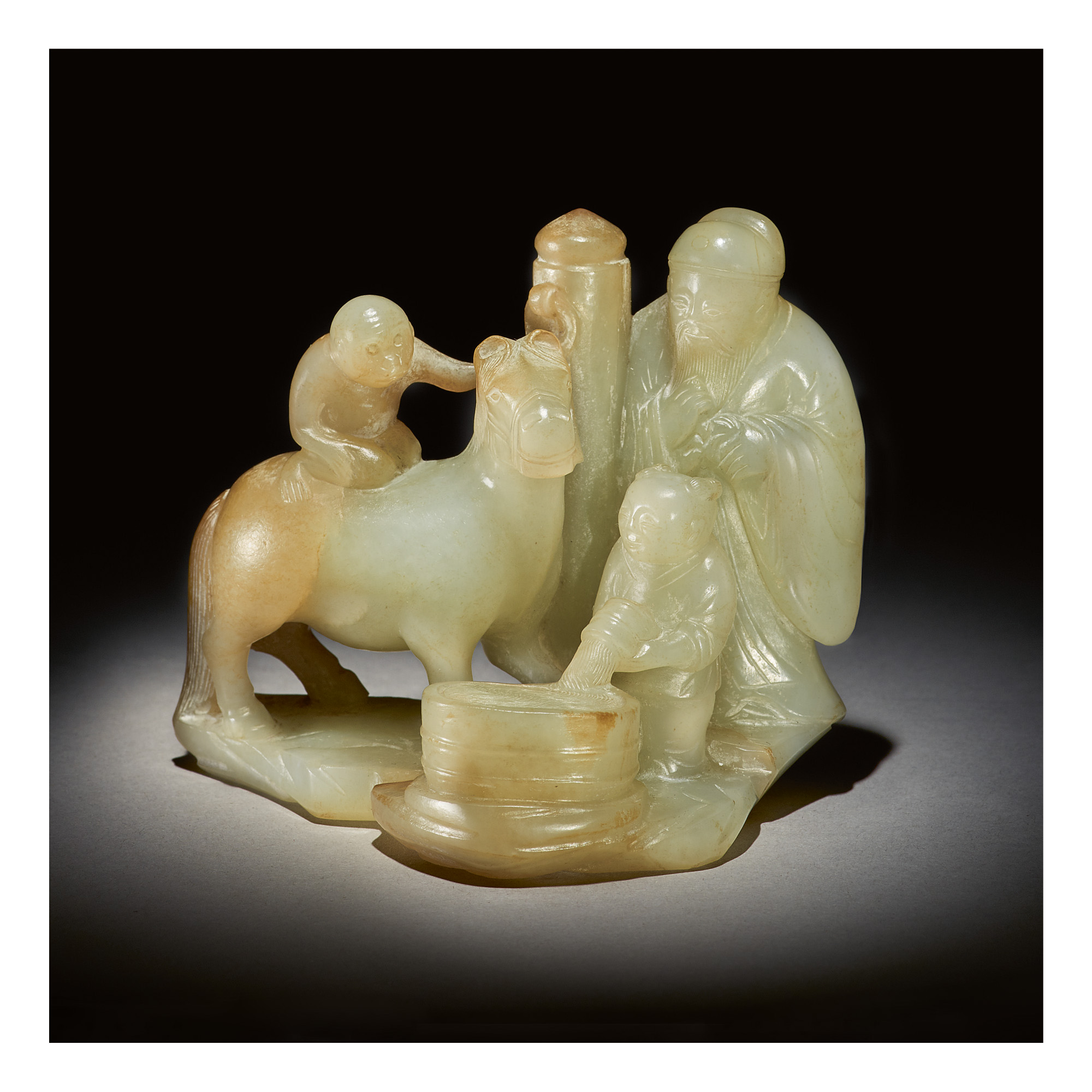 A VERY RARE WHITE AND RUSSET JADE 'SCHOLAR, MONKEY AND HORSE' GROUP ...