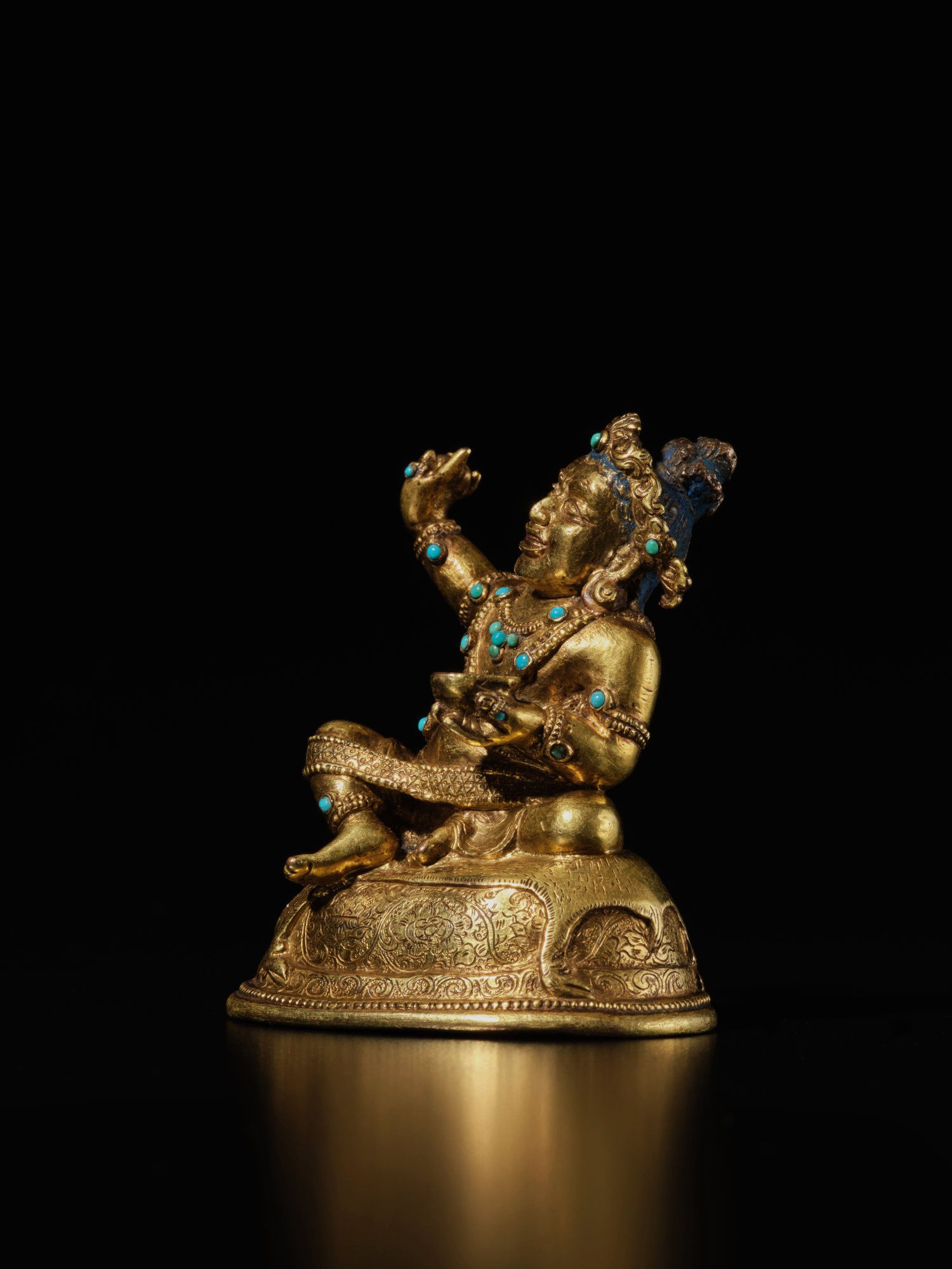 A turquoise-inlaid gilt-copper alloy figure of Virupa, Tibet, 15th ...