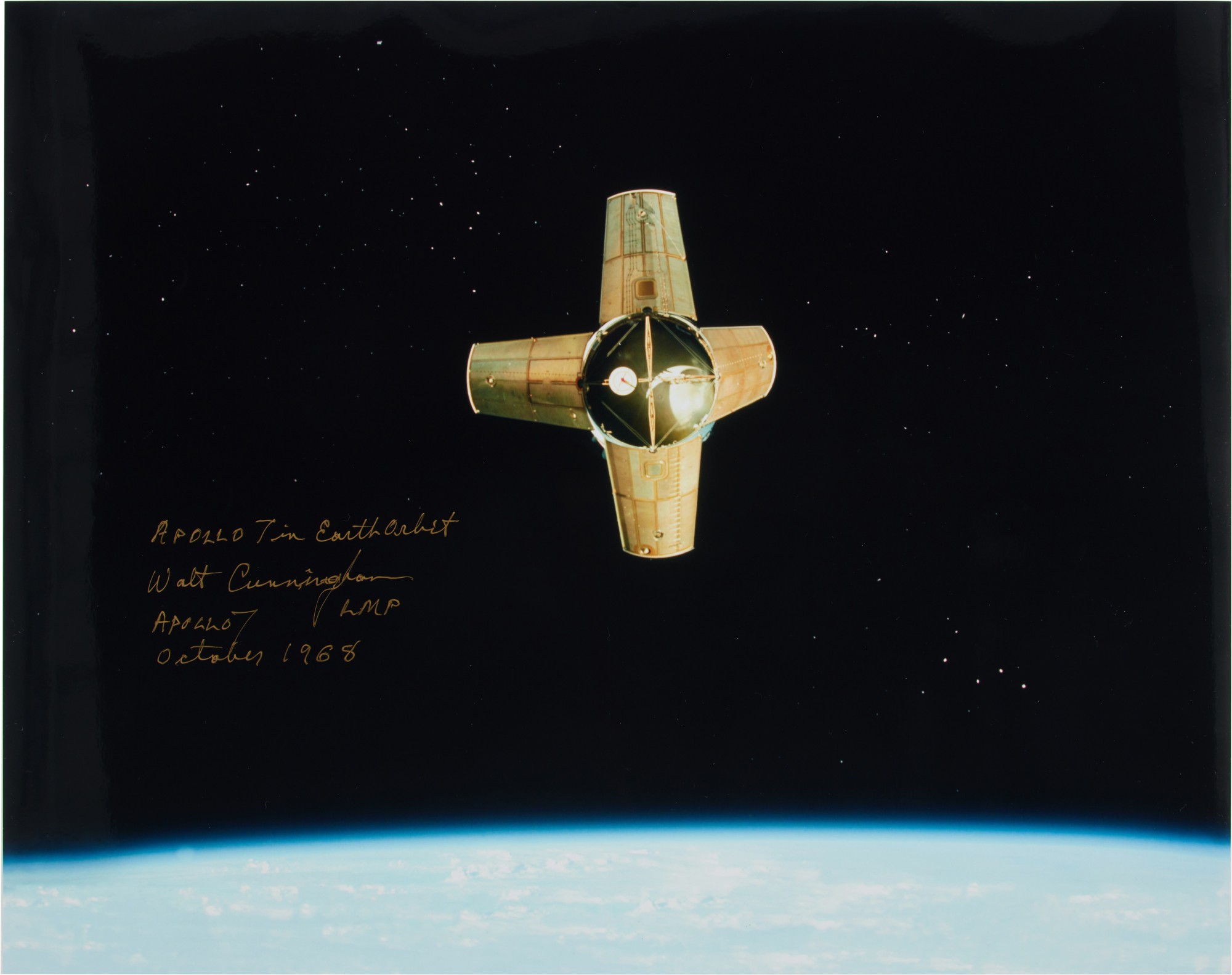 [Apollo 7] — In Earth Orbit. Color photograph, signed and inscribed by ...