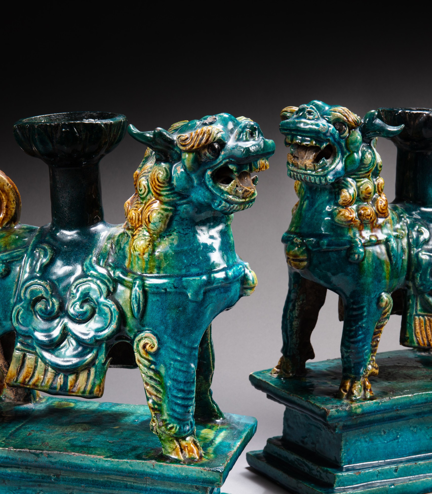 A pair of turquoise-and-yellow-glazed 'qilin' candlesticks 17th-18th ...