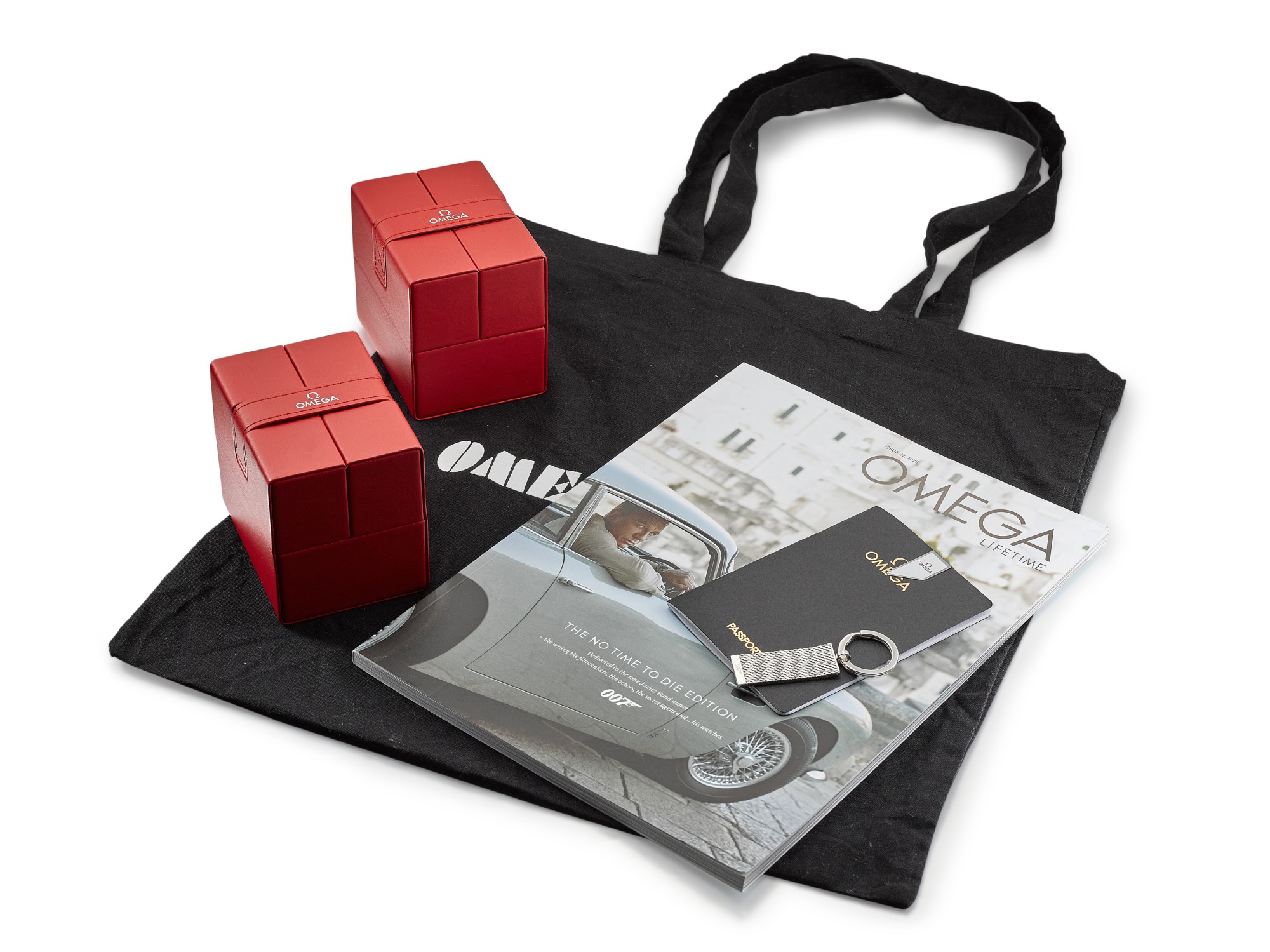A group of key chain, tote bag, magazine, wallet and two travelling ...