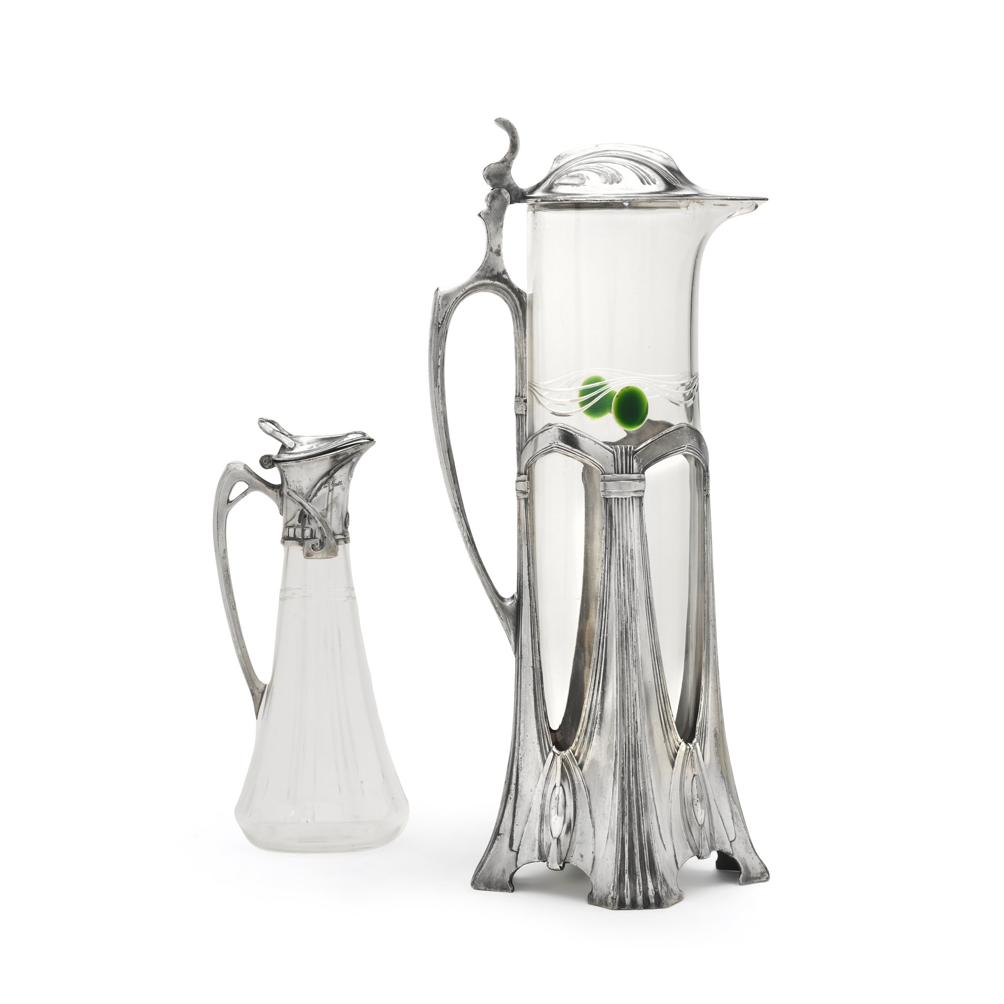 Two metal-mounted lidded glass ewers, in the Austrian Secessionist ...