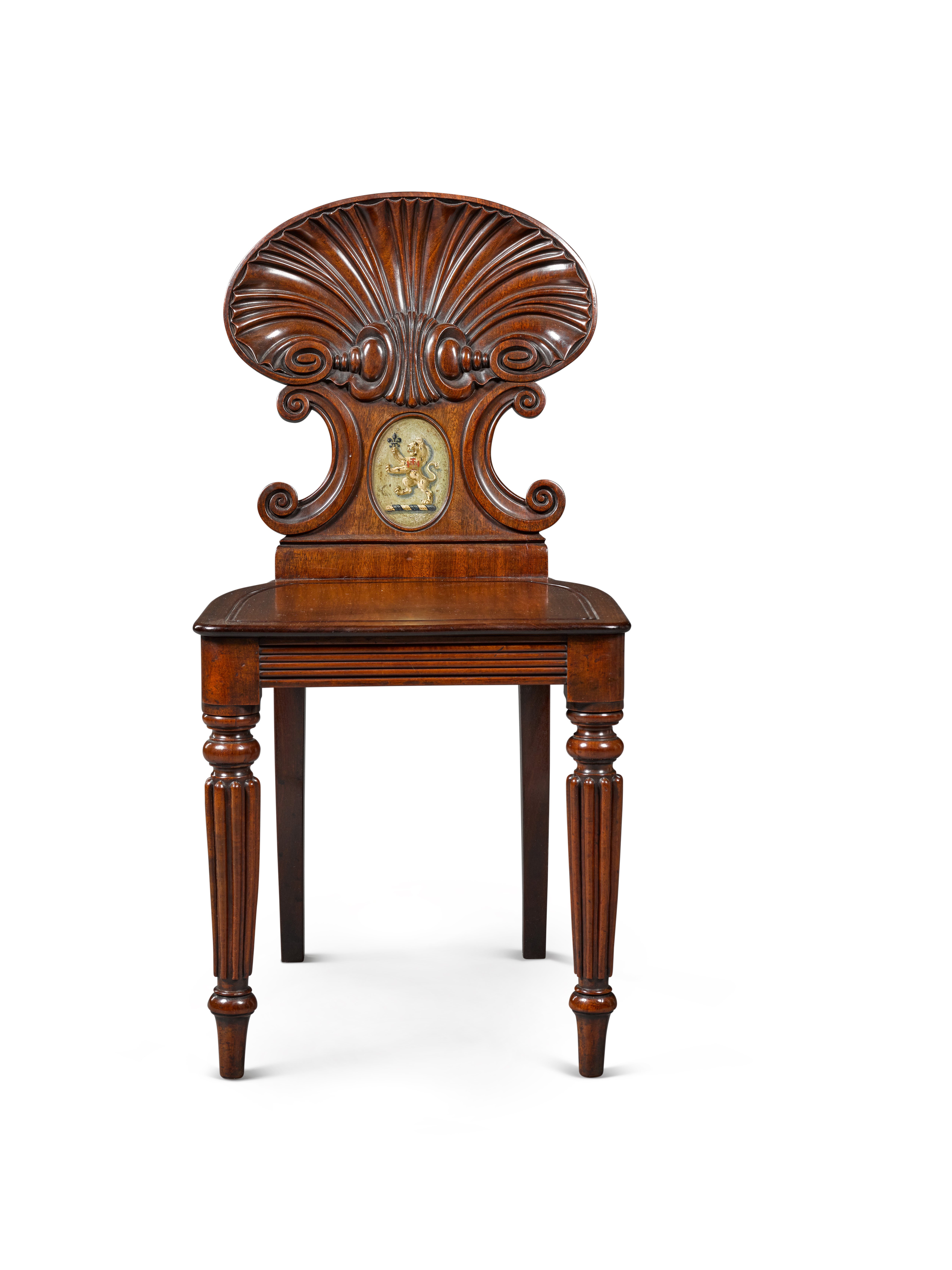A pair of late Regency mahogany hall chairs, circa 1825, attributed to ...
