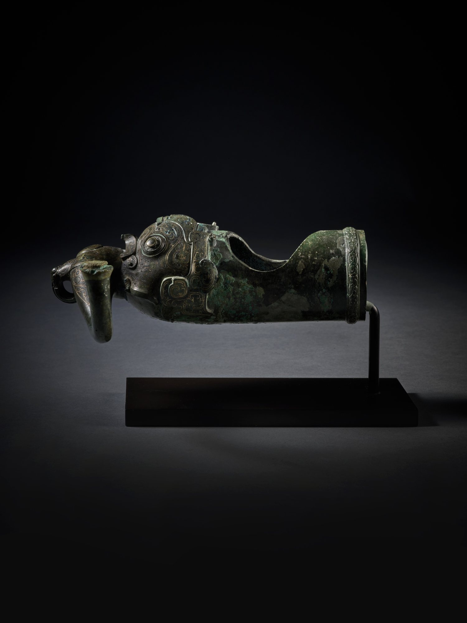 An exceptionally rare silver and gold-inlaid zoomorphic fitting Eastern ...